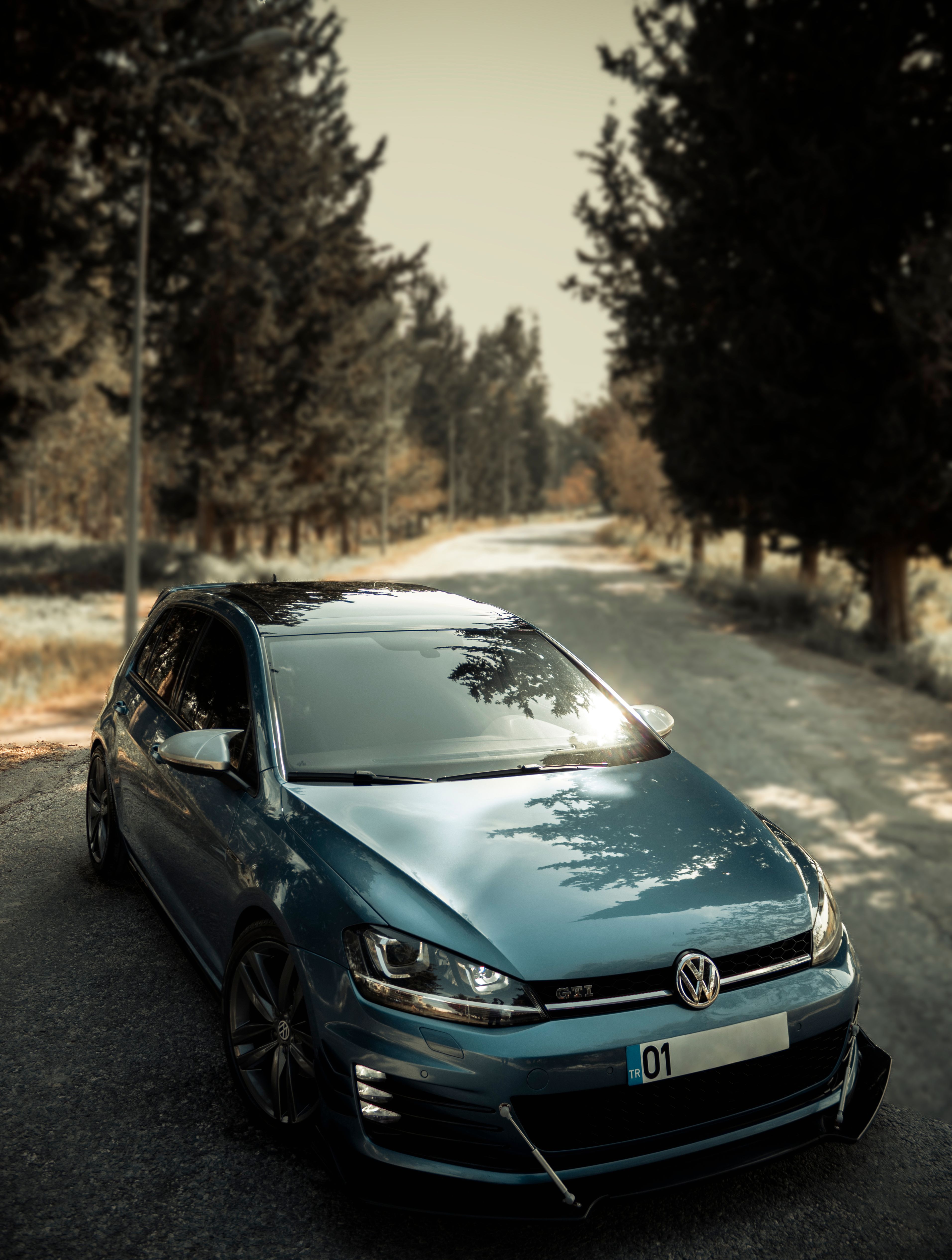 Lowered Cars Parked Beside a Building · Free Stock Photo