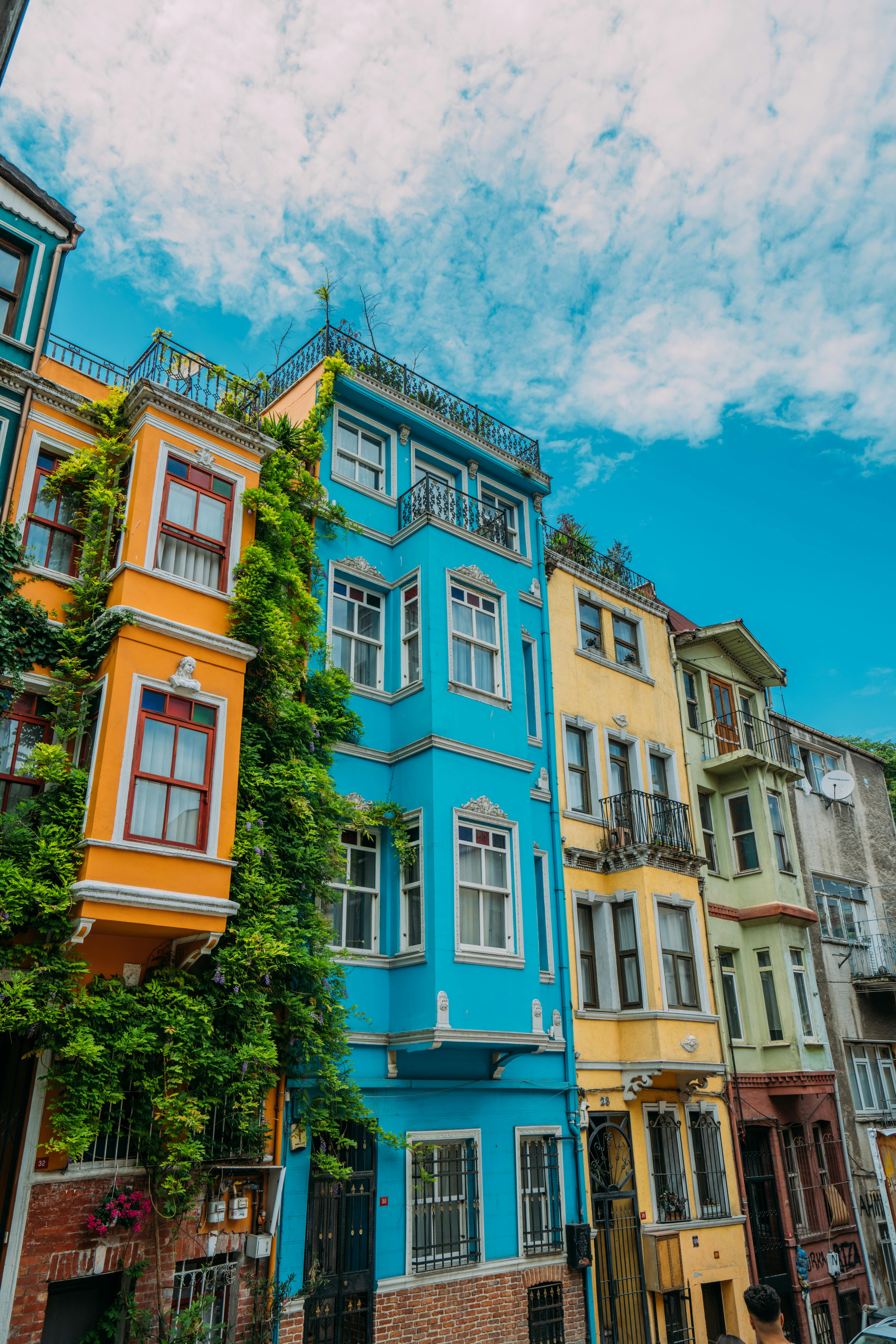 Colorful Apartment Buildings Under Blue Sky · Free Stock Photo