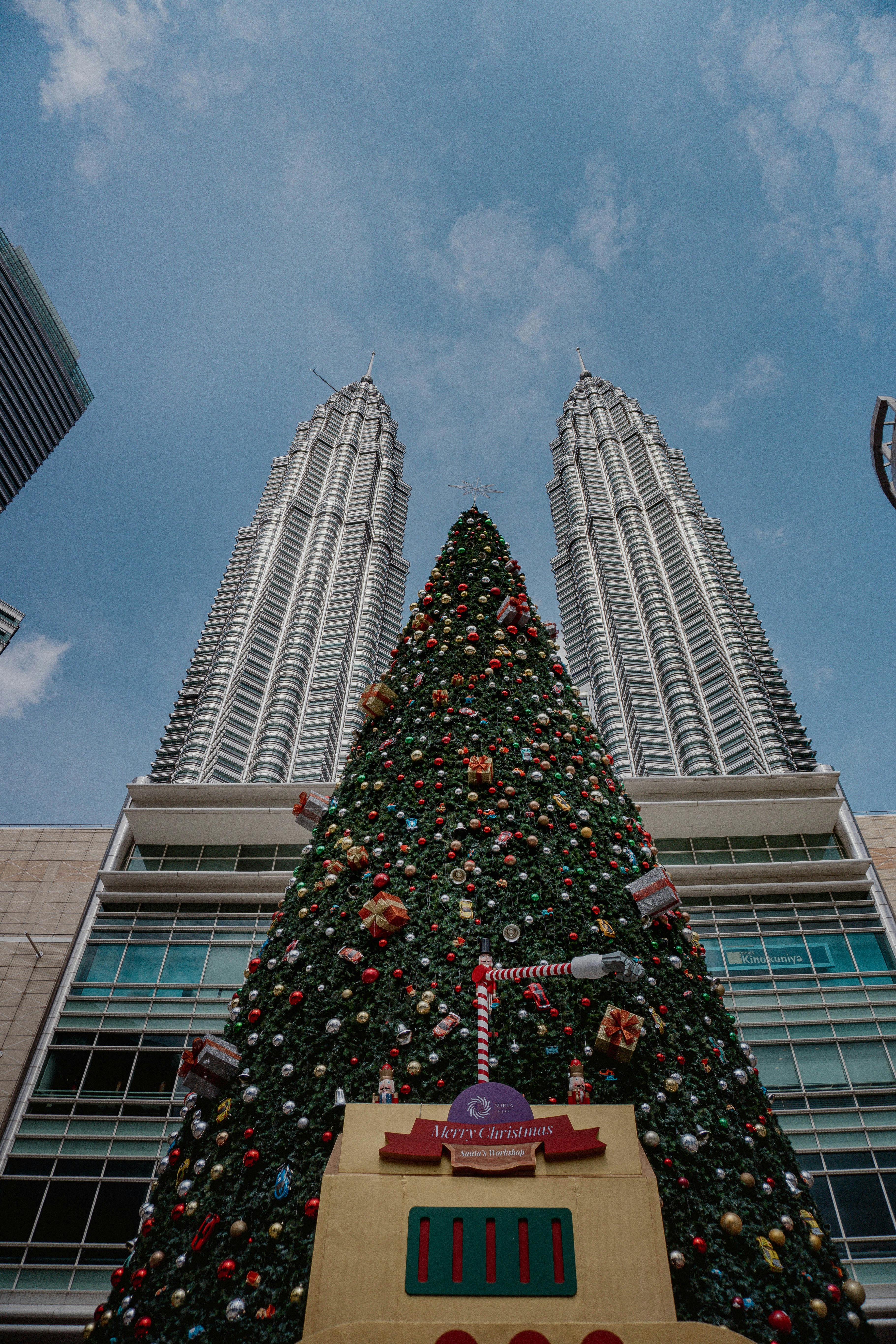 Christmas Tree in Front of the Petronas Towers · Free Stock Photo