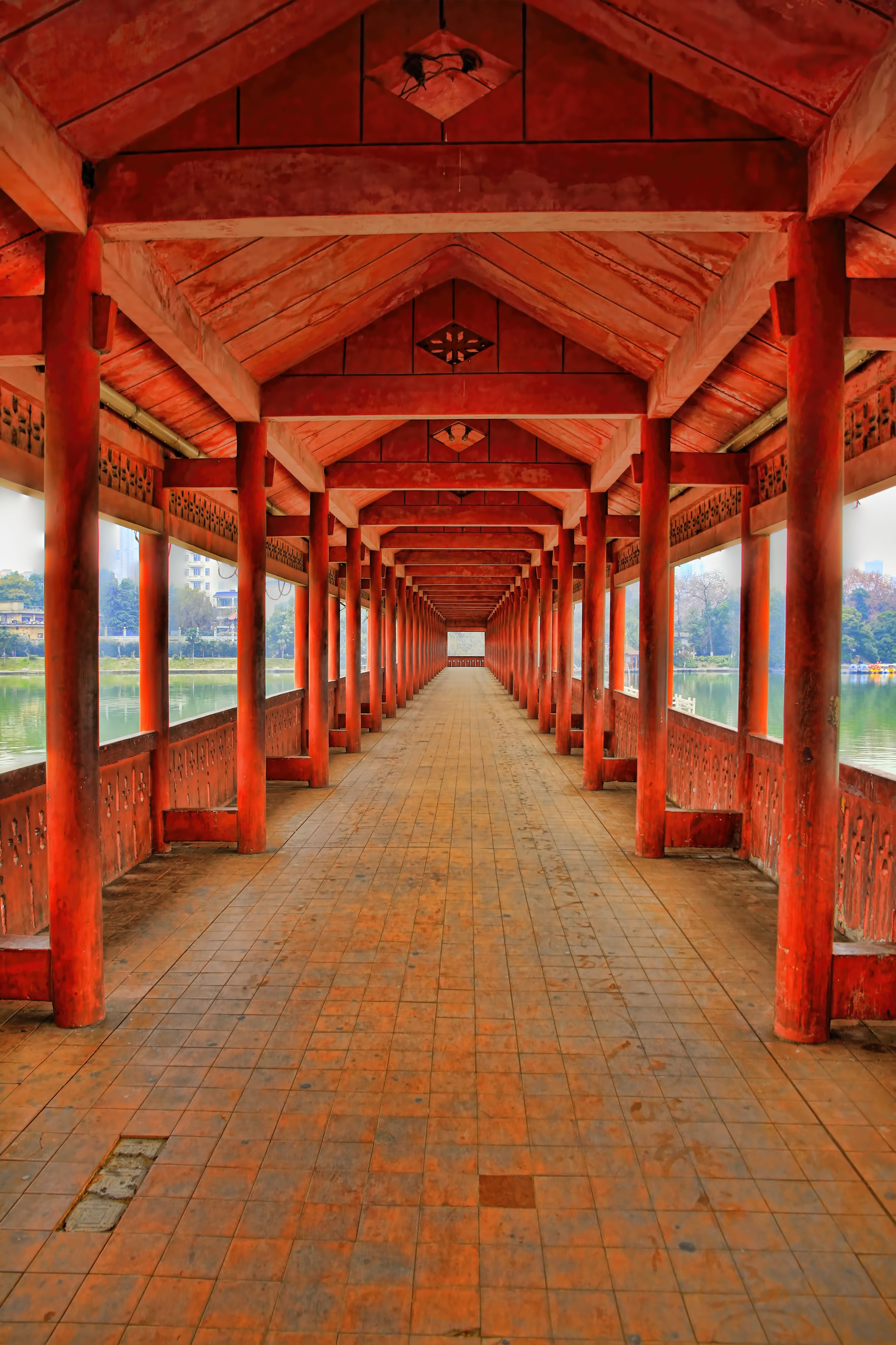 Diminishing Perspective of a Red Painted Wooden Covered Bridge · Free ...