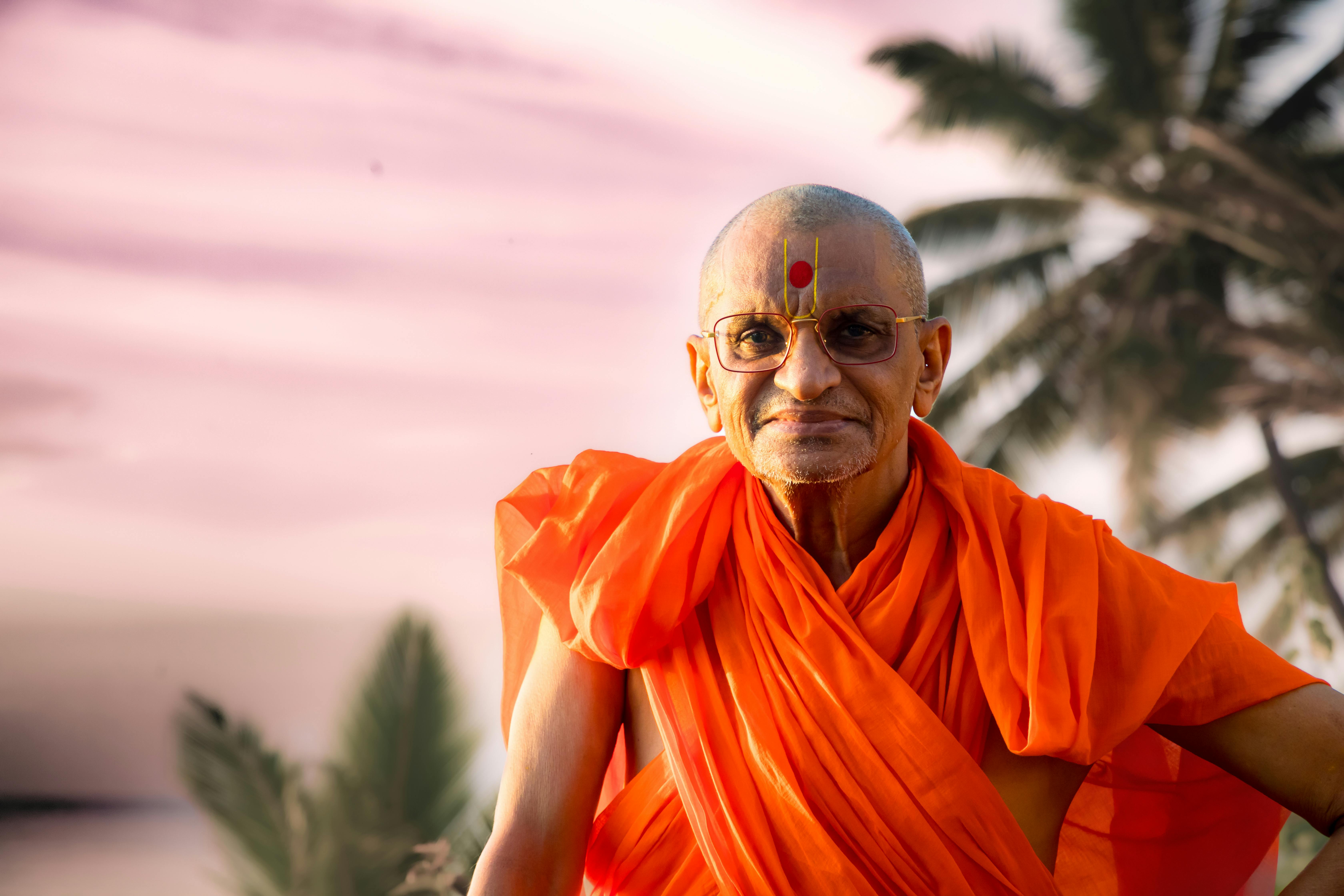 A Monk in Traditional Orange Robe · Free Stock Photo