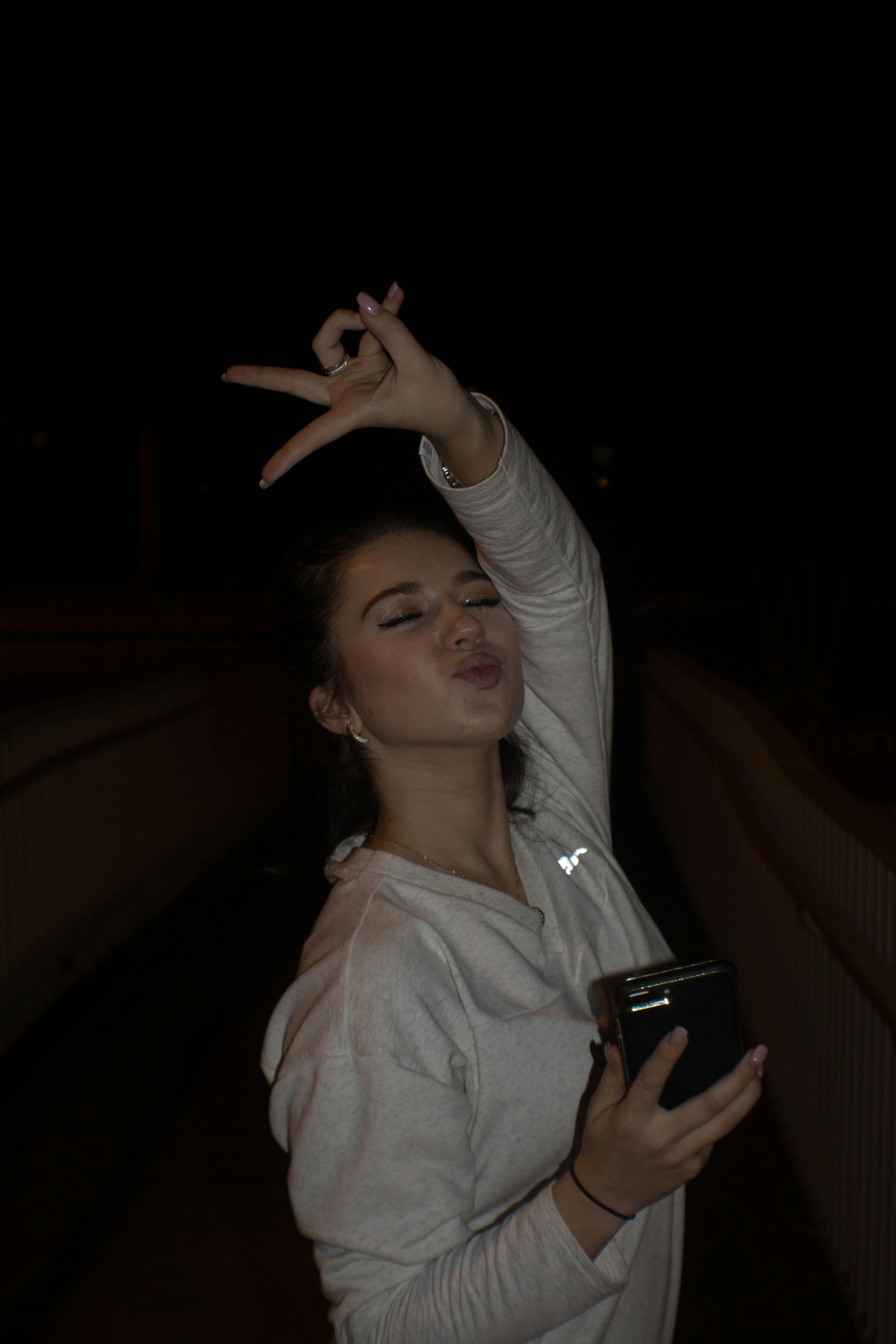 Woman Making Peace Sign Gesture · Free Stock Photo