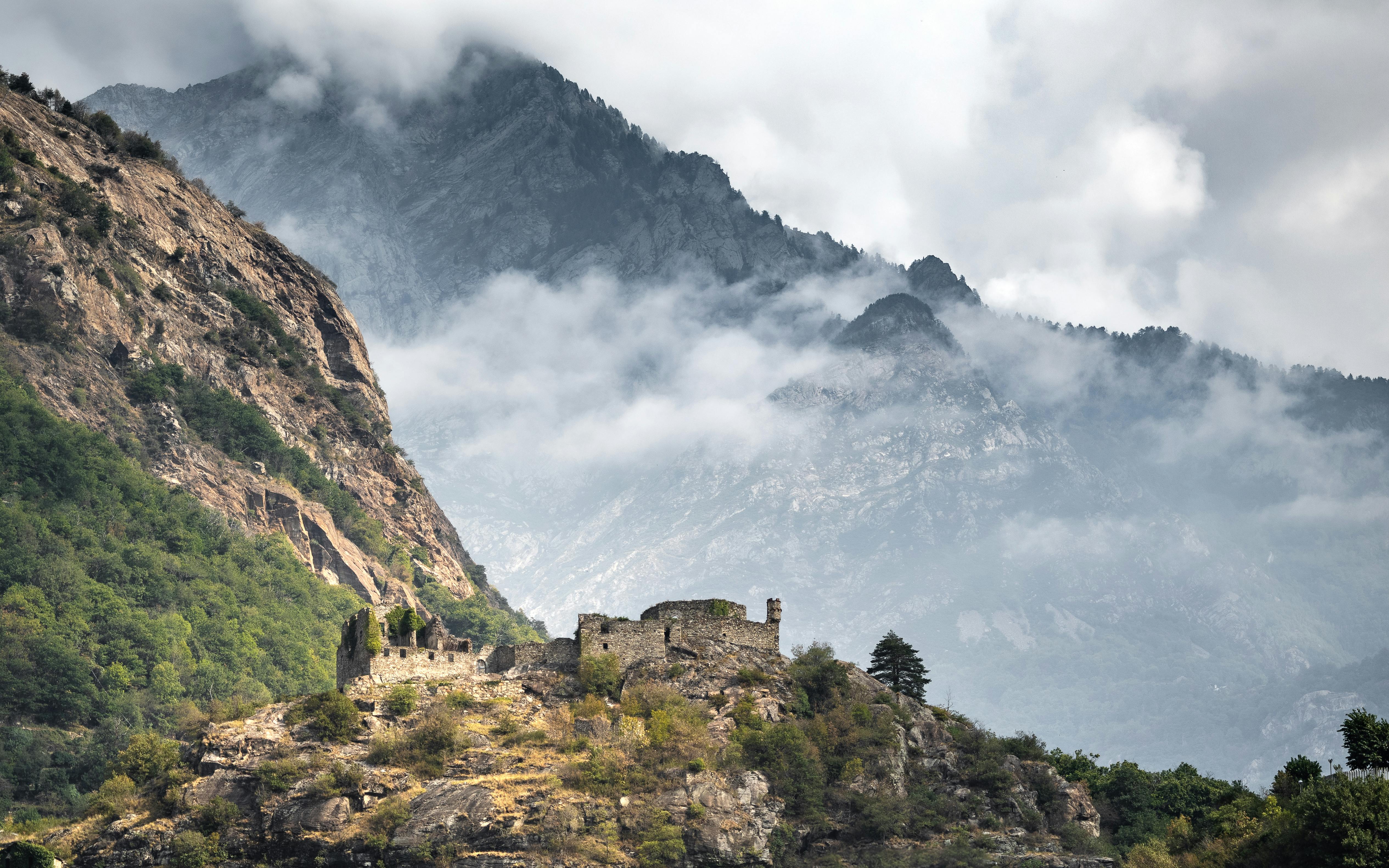 Landscape of Mountains with Ruins on Hill below · Free Stock Photo