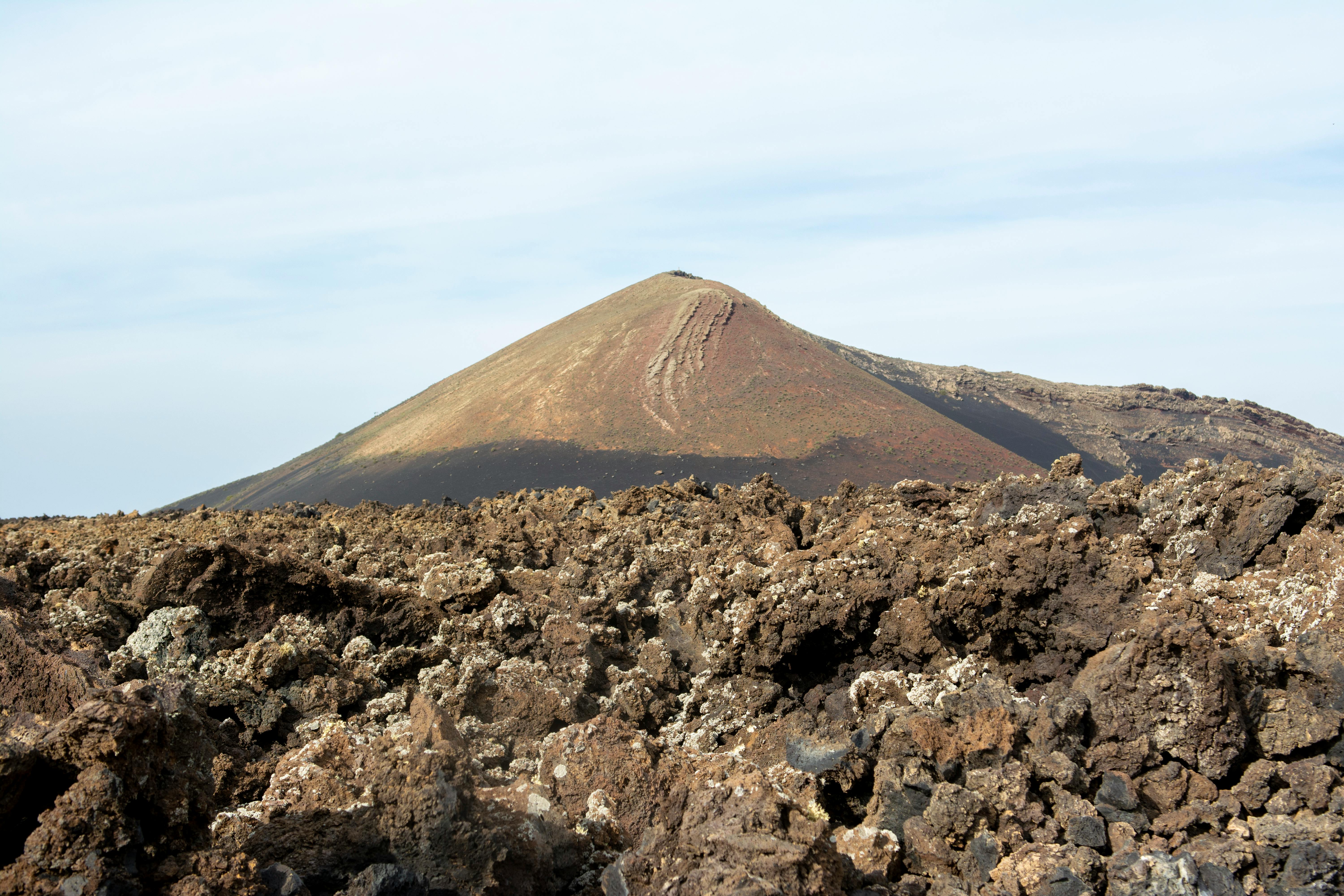 A Volcano Surrounded by Brown Rocks · Free Stock Photo