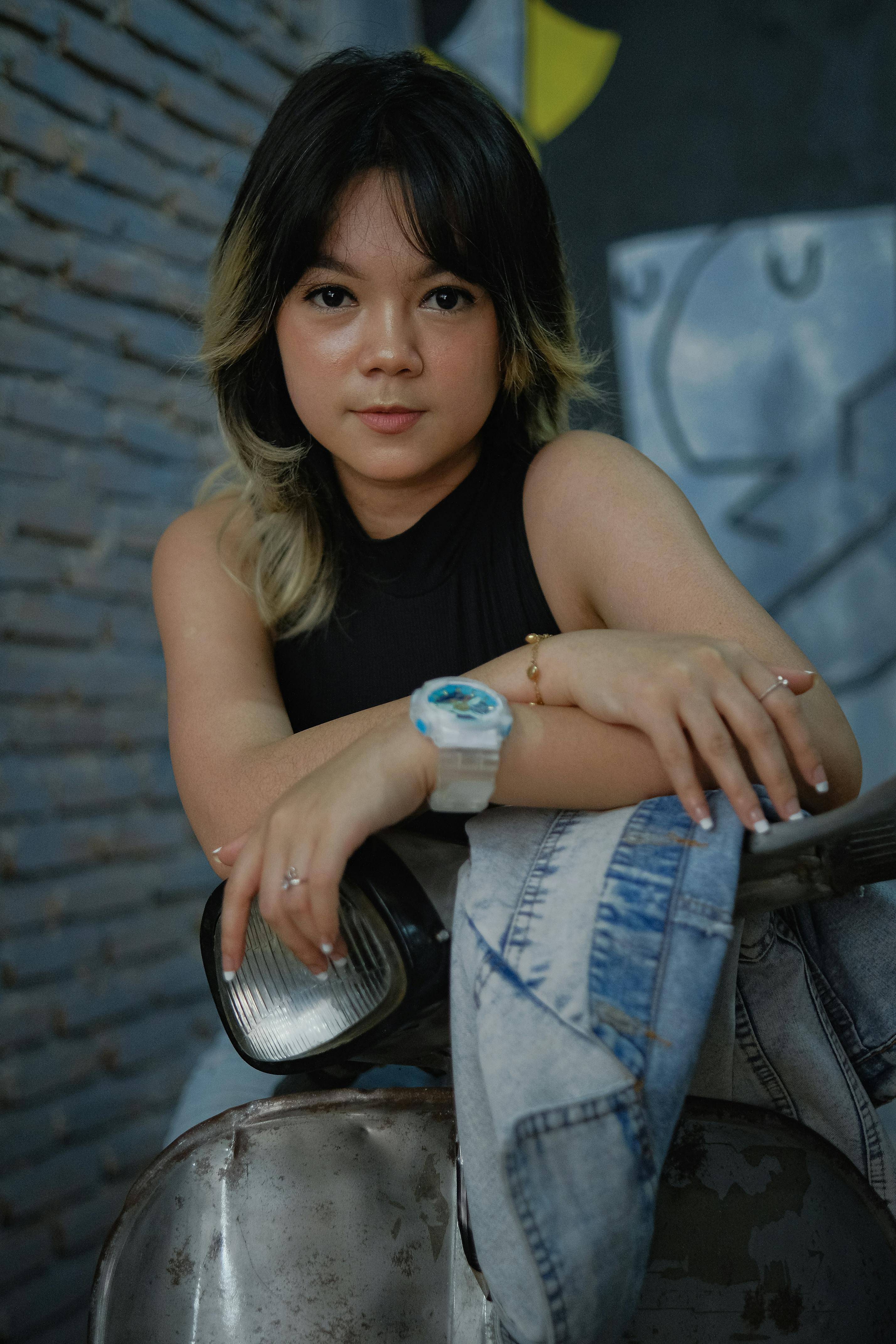 Beautiful Girl Standing Beside Clothing Rack · Free Stock Photo