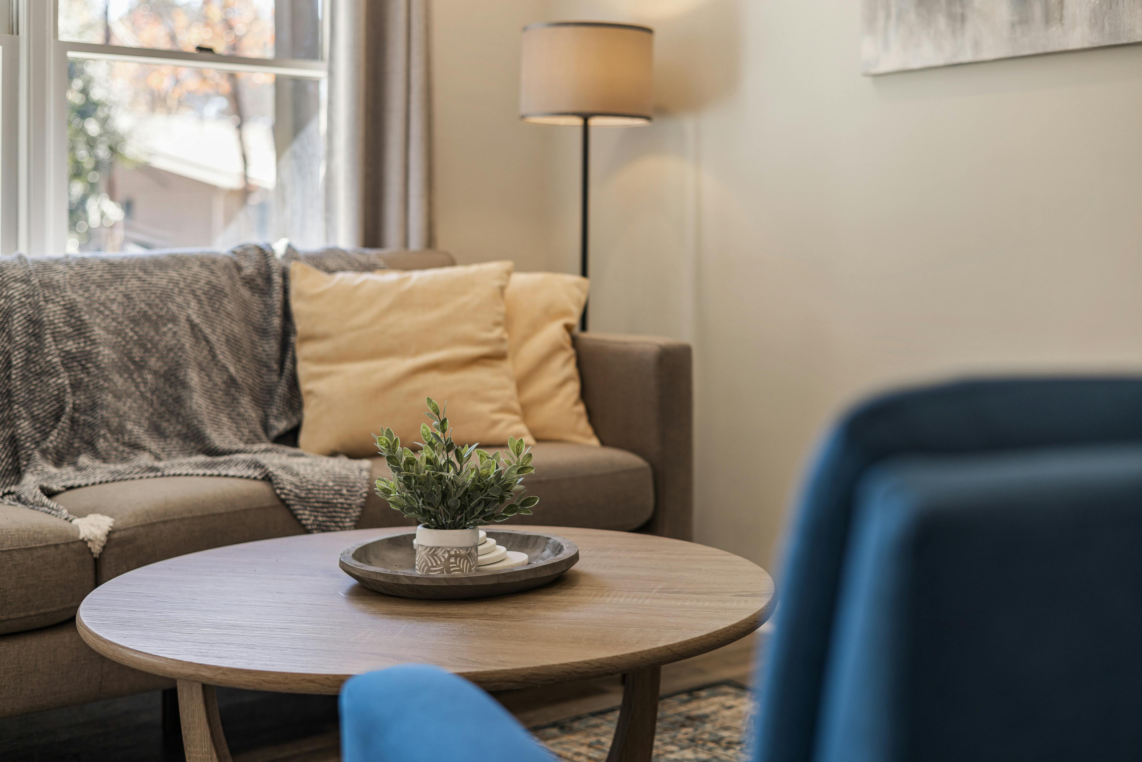Wooden White Armchair Beside a Small Round Table · Free Stock Photo