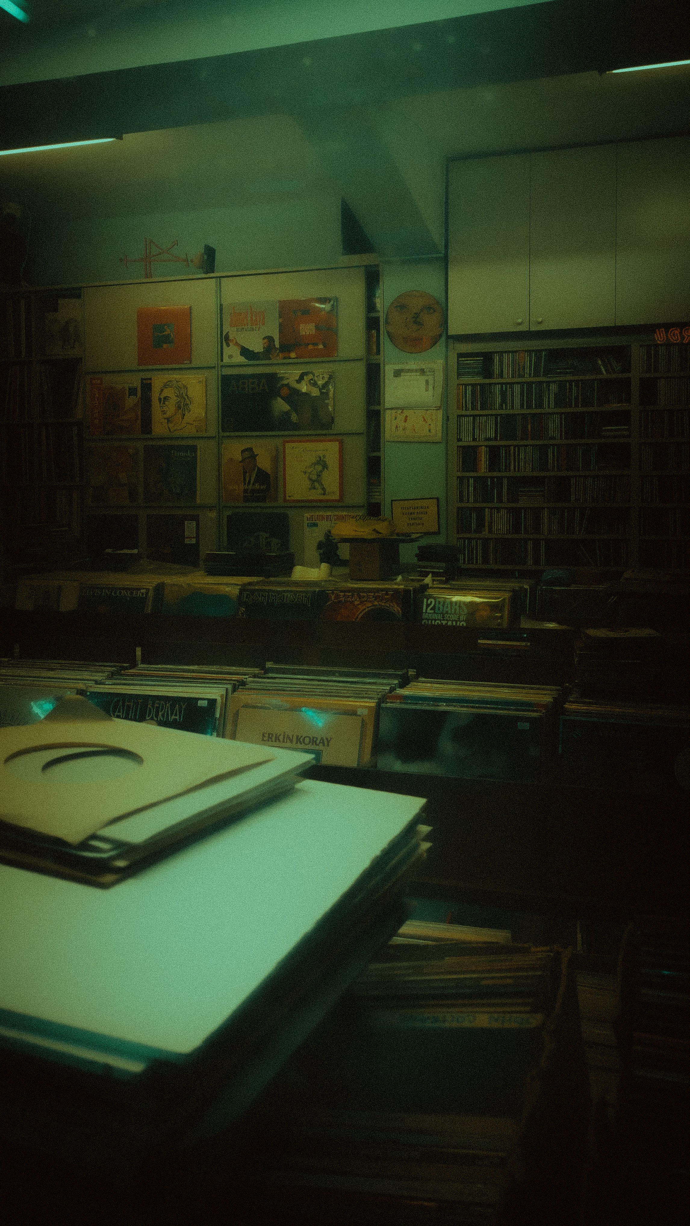 Dark Interior of a Shop with Vintage Recordings · Free Stock Photo