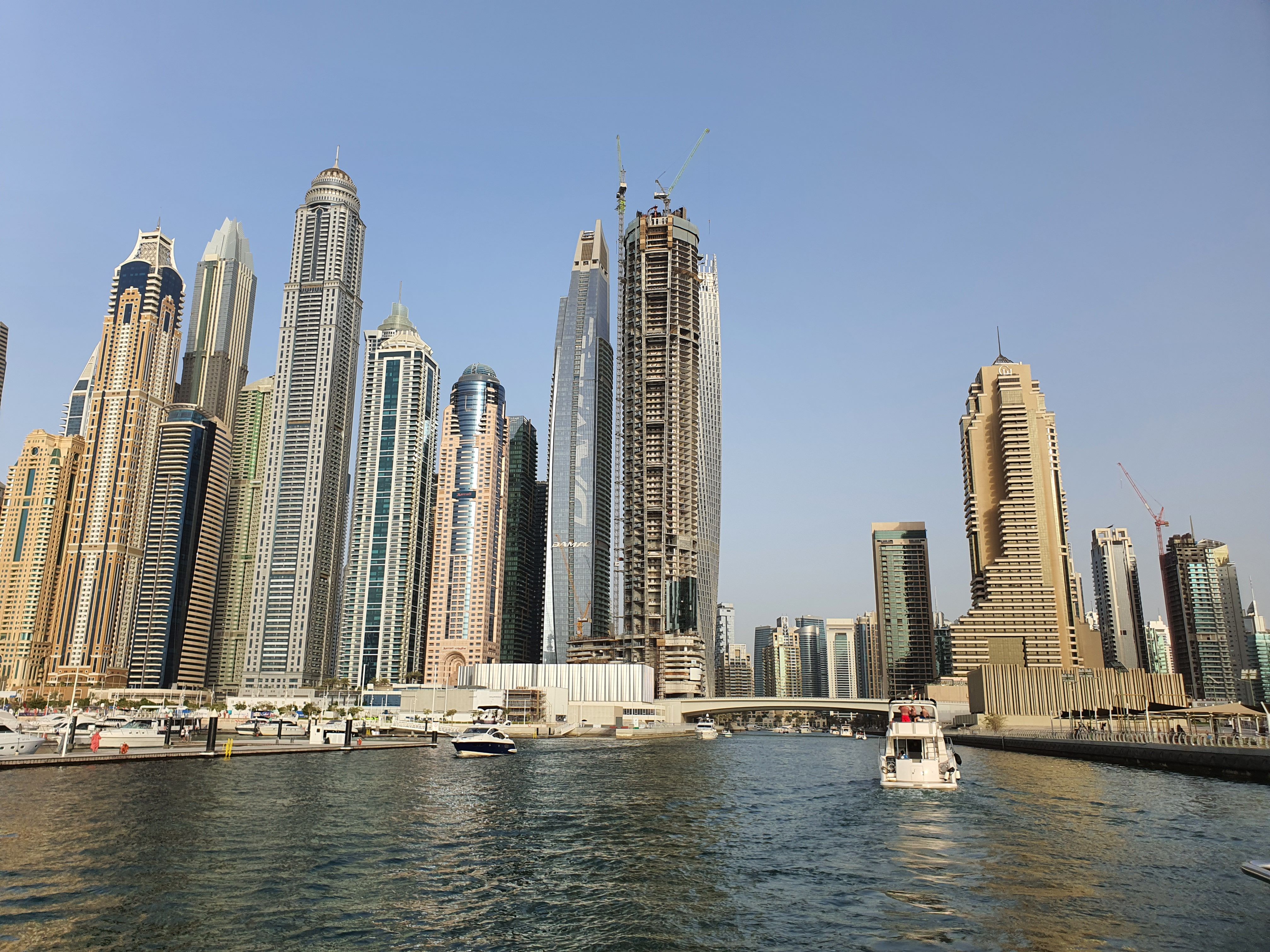 White and Brown High Rise Buildings Near Body of Water · Free Stock Photo