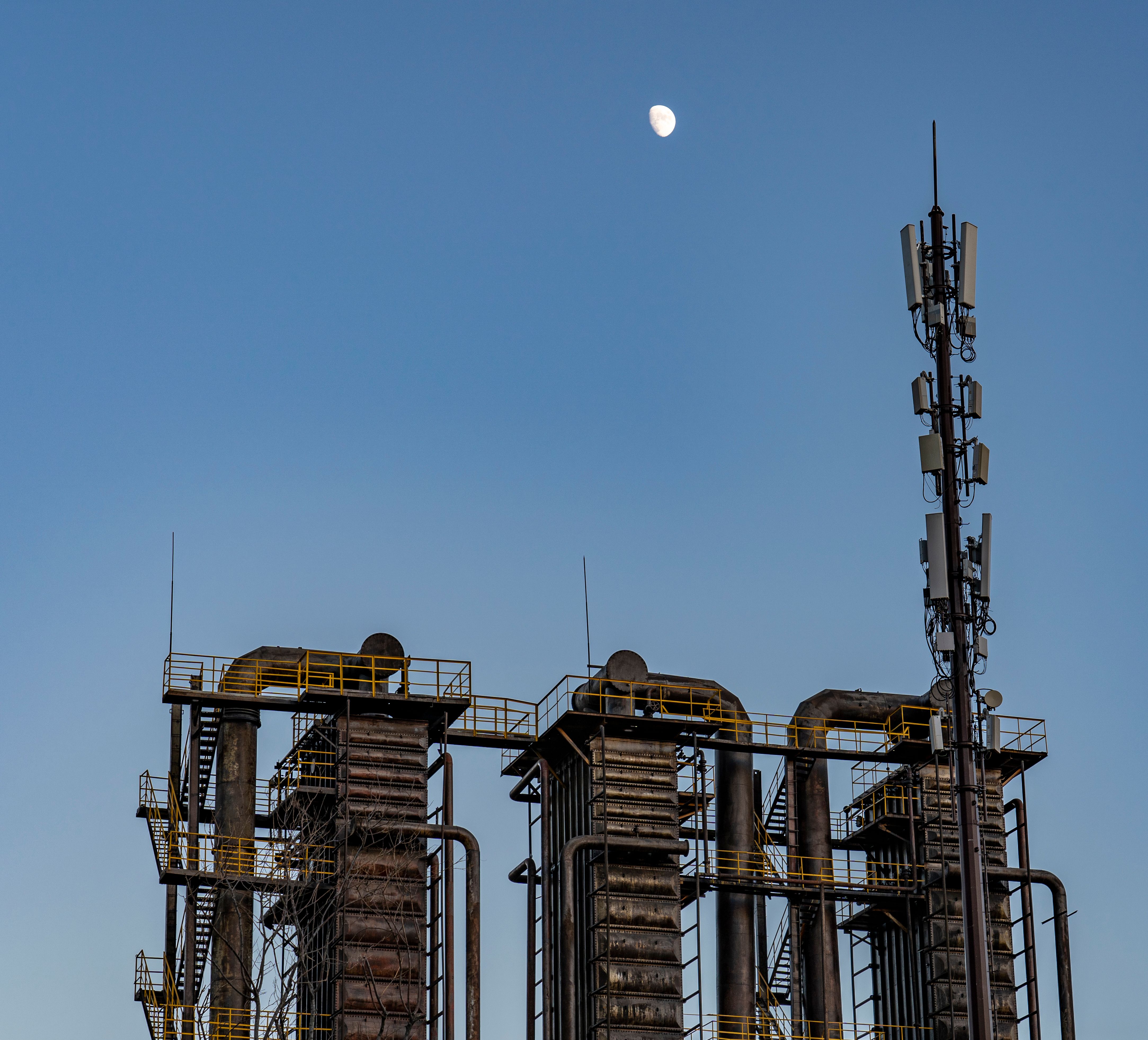 Moon in Blue Sky above Industrial Plant · Free Stock Photo