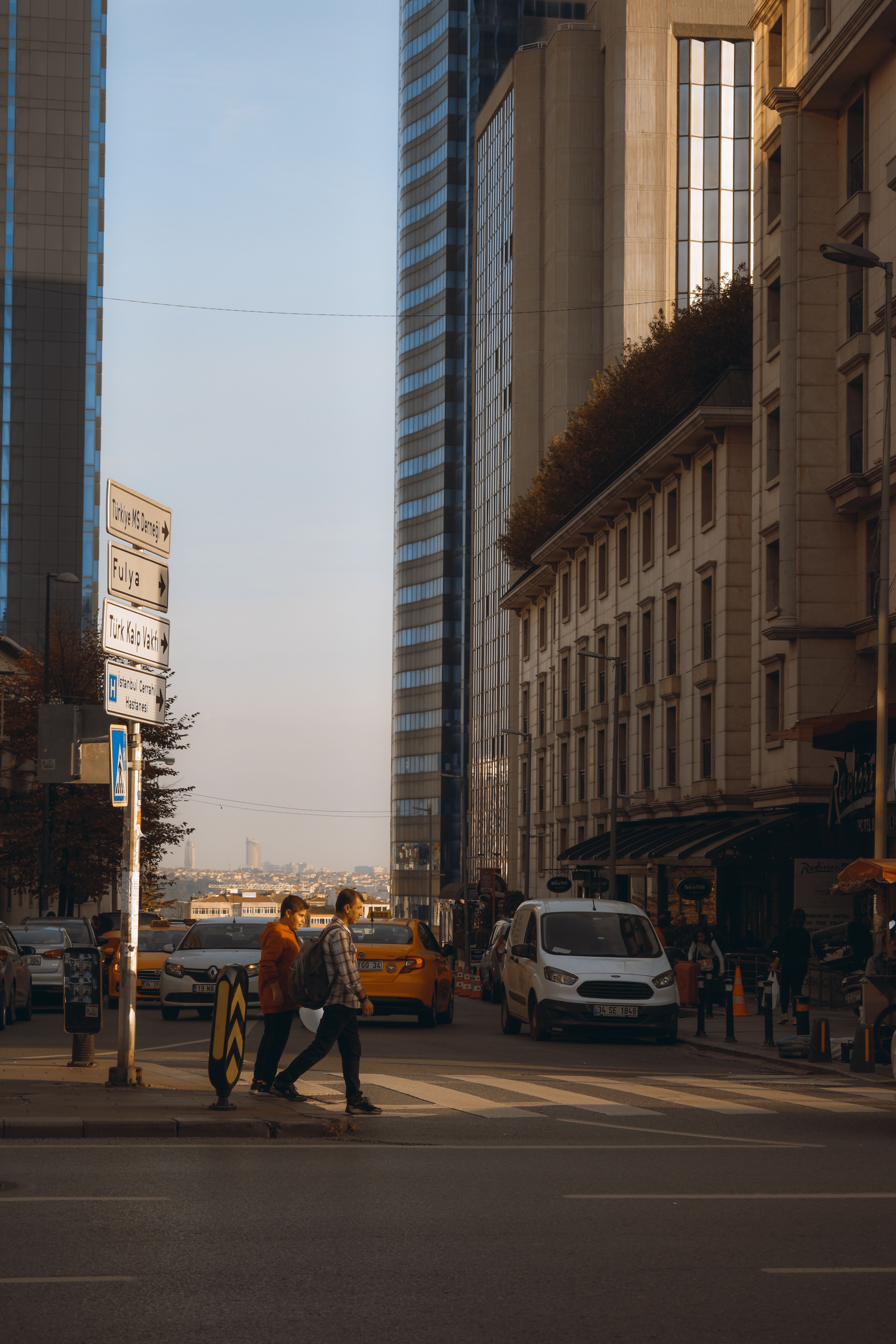 Man Walking on Pedestrian Crossing · Free Stock Photo