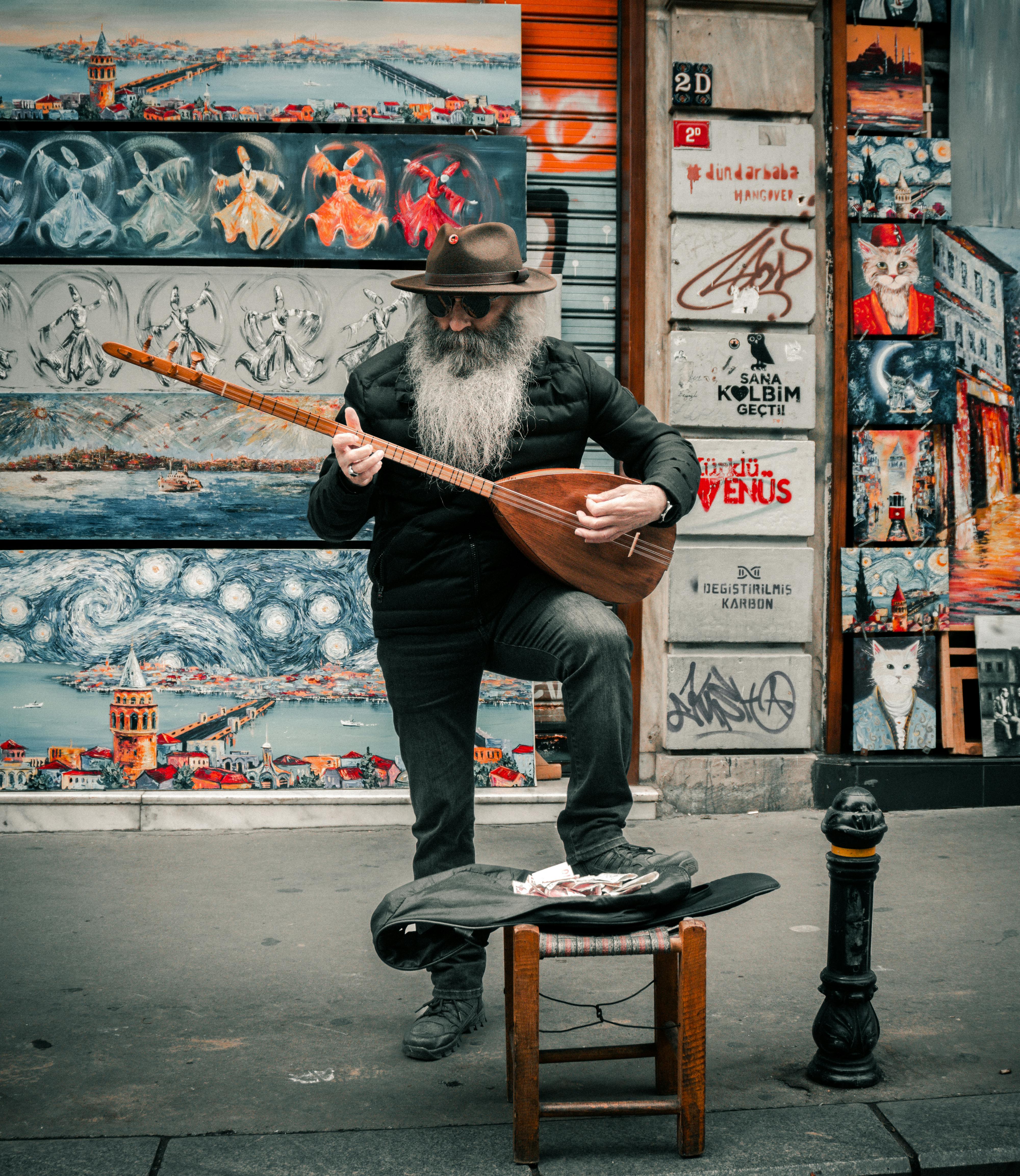 Man with Gray Beard Playing Traditional Musical Instrument · Free Stock ...