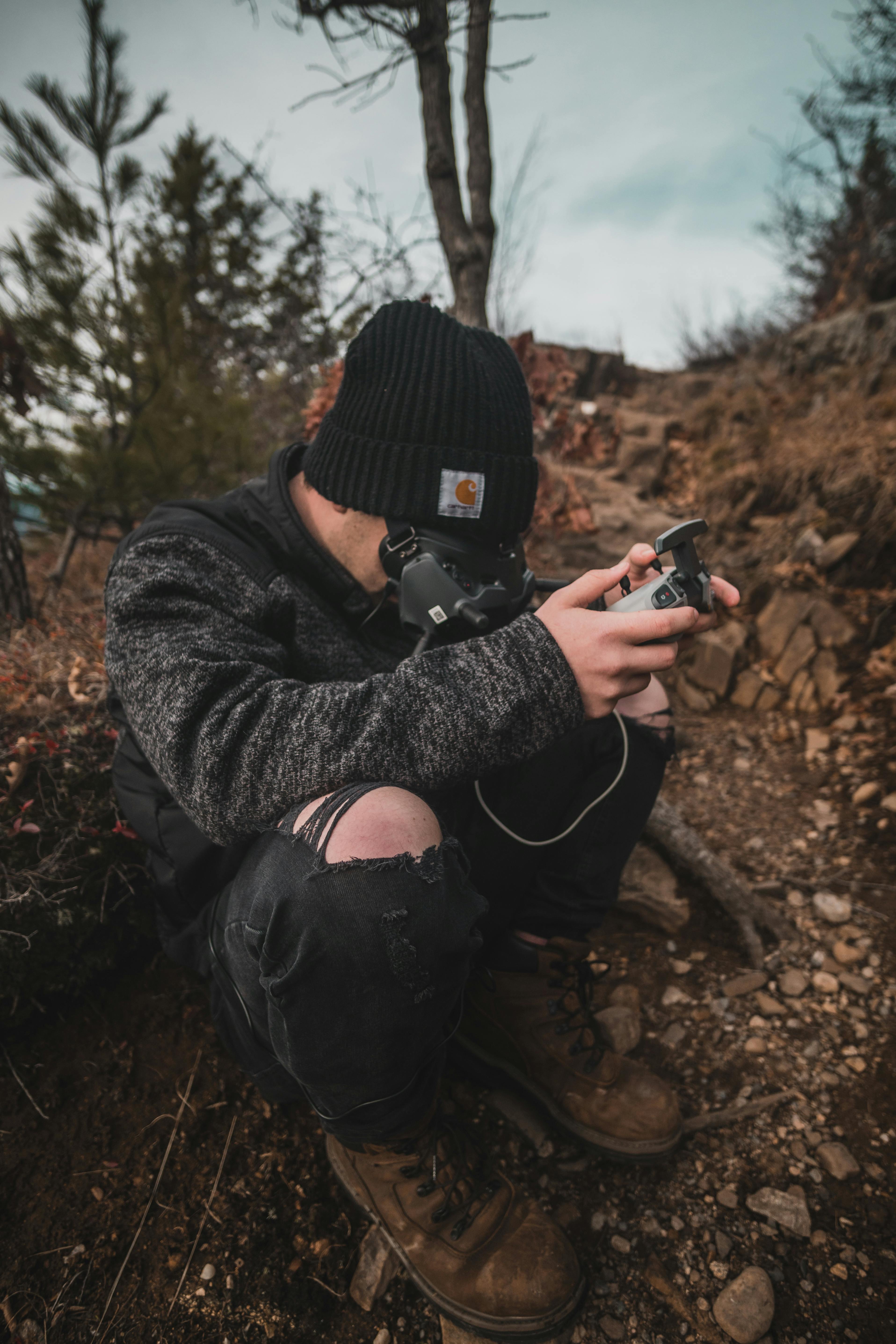 Young Man Setting up a Drone Camera · Free Stock Photo
