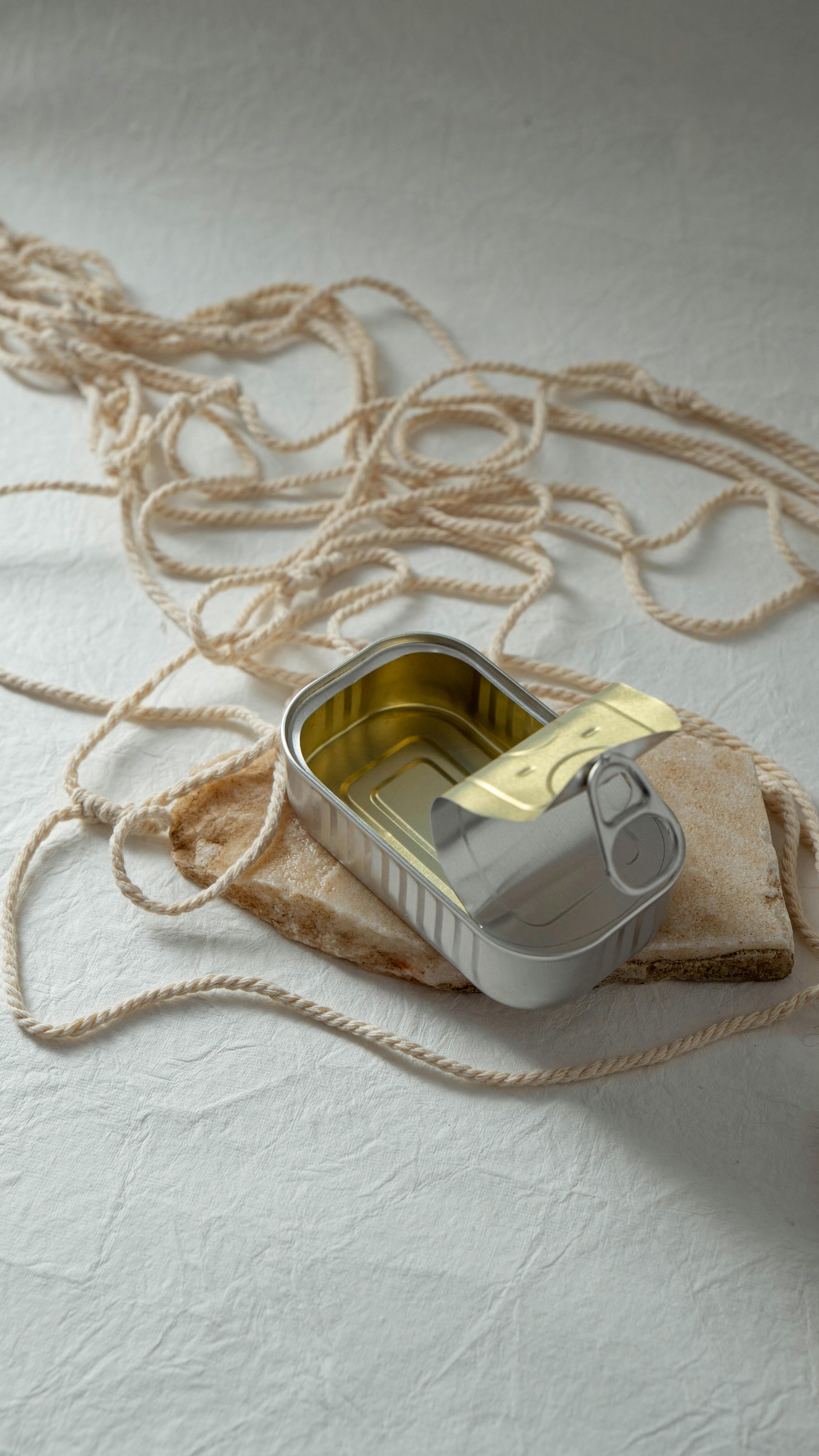 Empty Open Tin on Stone Slab · Free Stock Photo