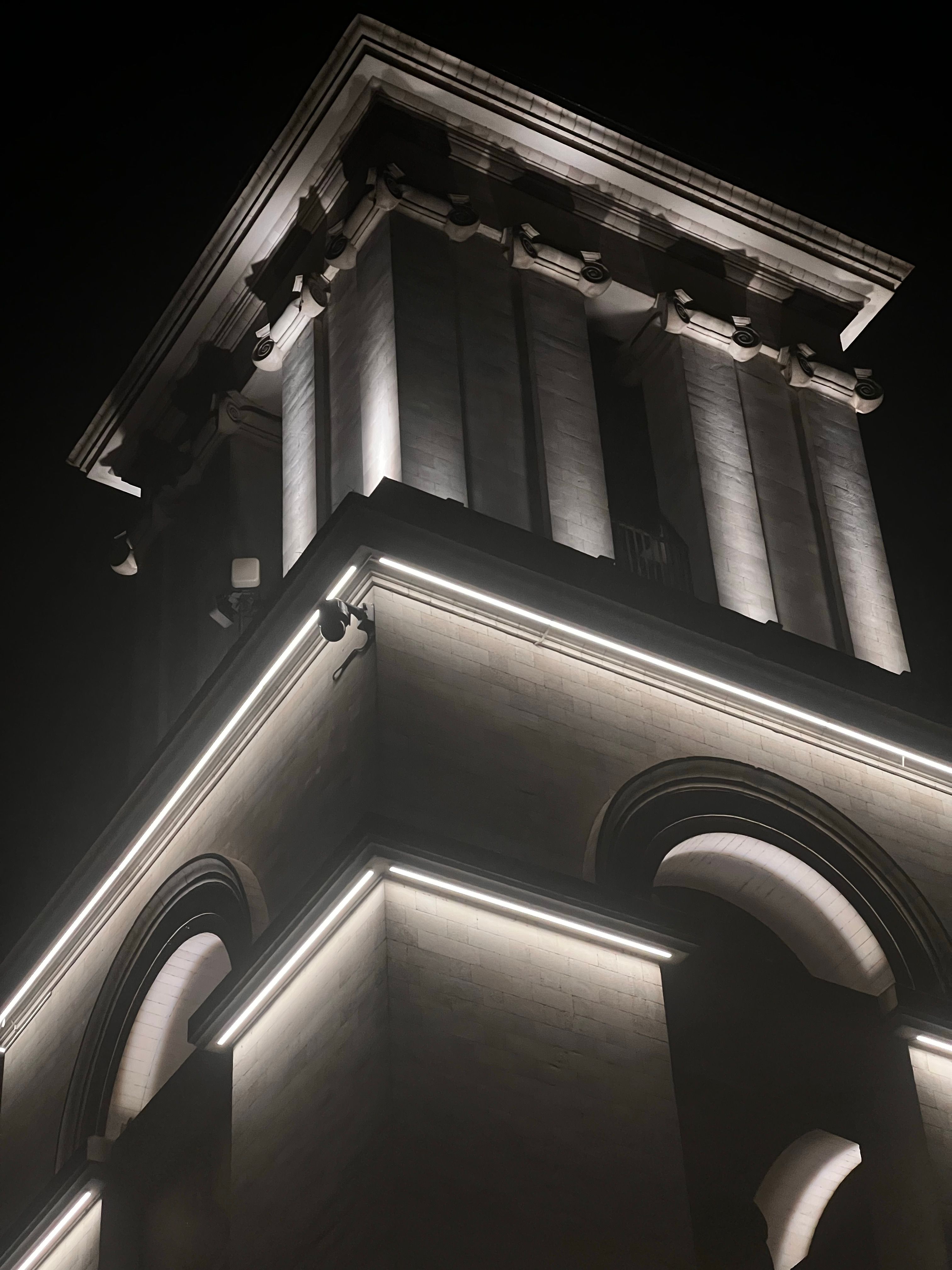 Illuminated Stone Building on Night Sky · Free Stock Photo