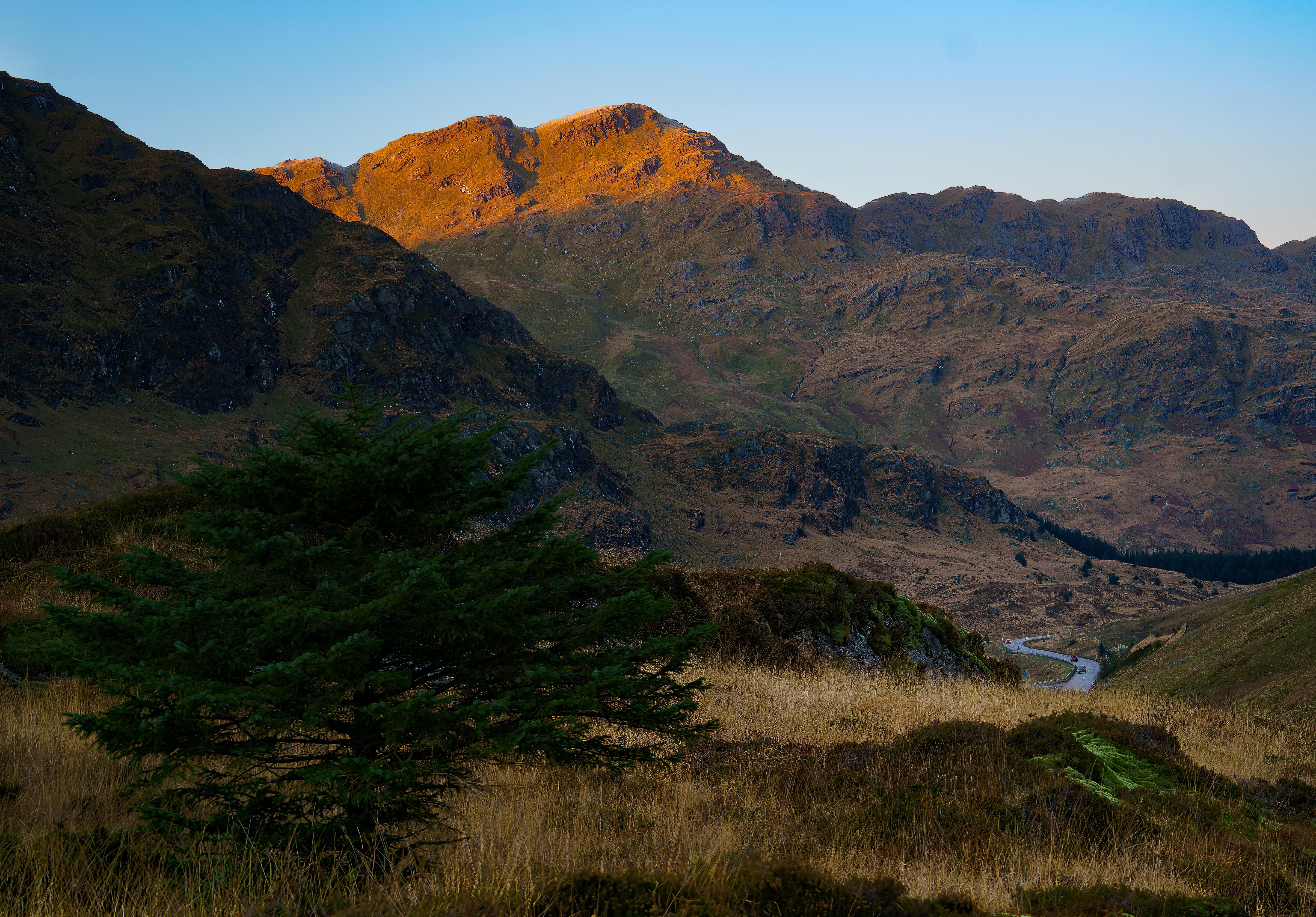 Grass Field Between Two Mountains · Free Stock Photo