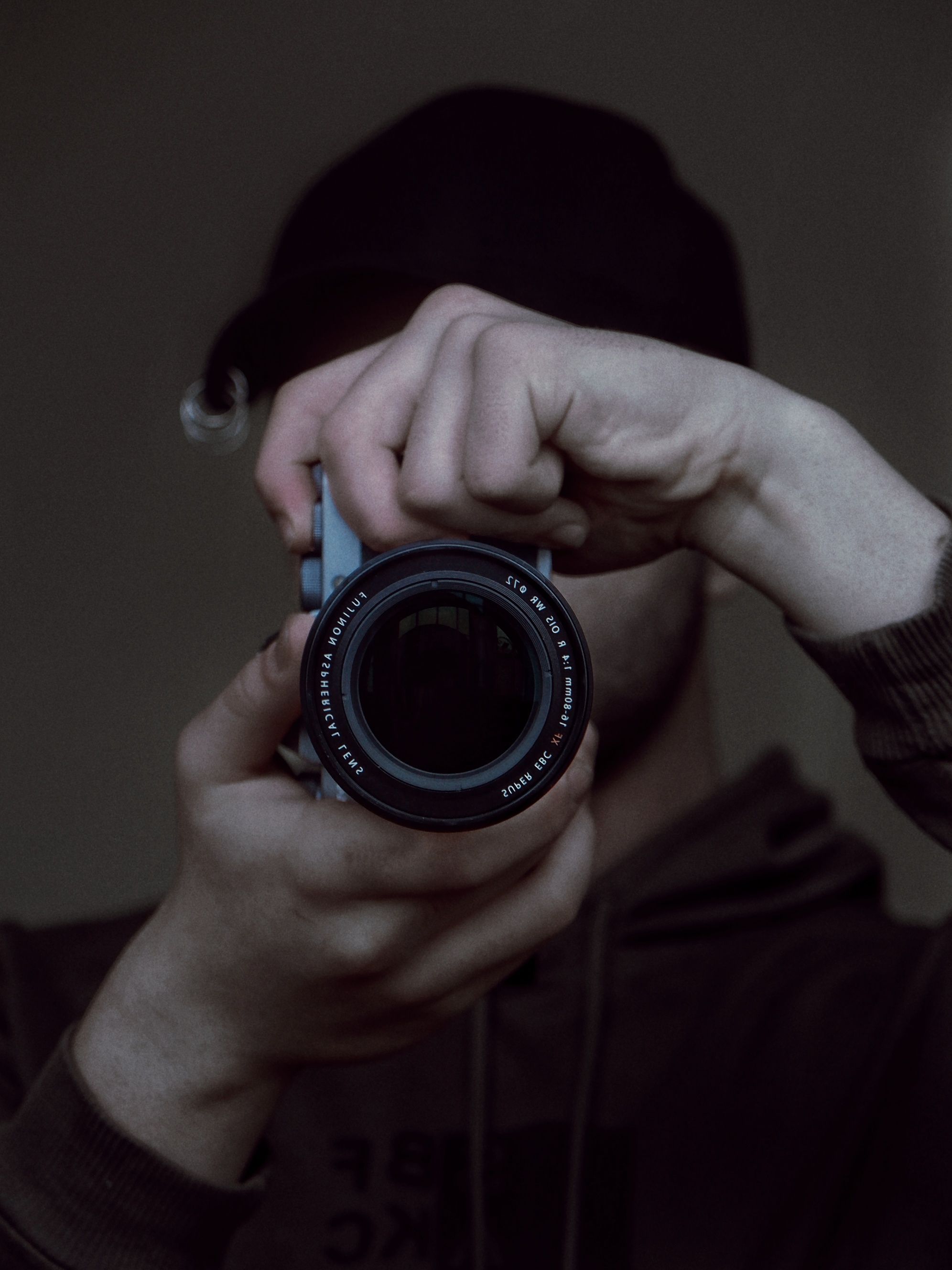 Person on Autumn Ground Holding Camera · Free Stock Photo