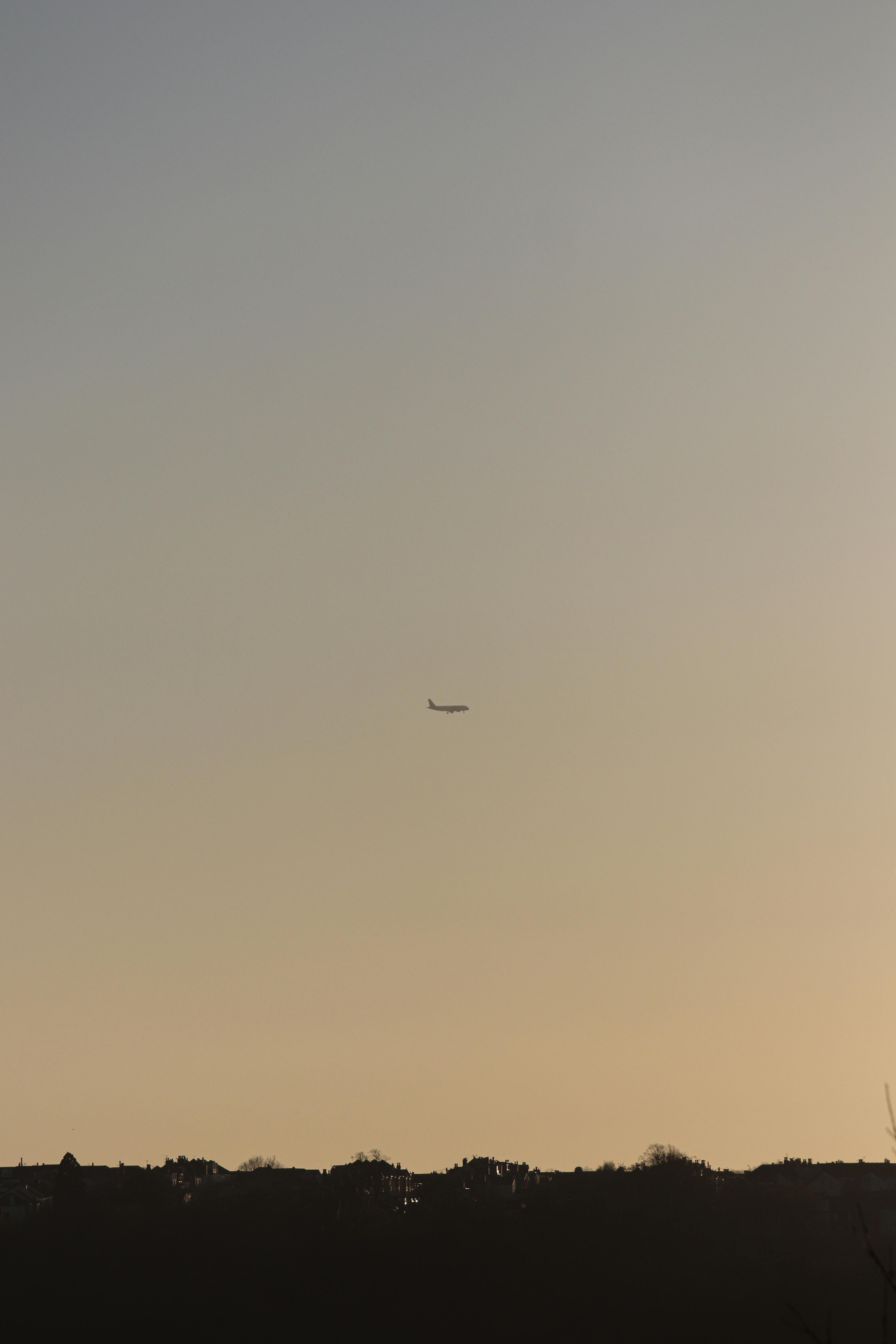 Plane Flying Through Sky · Free Stock Photo