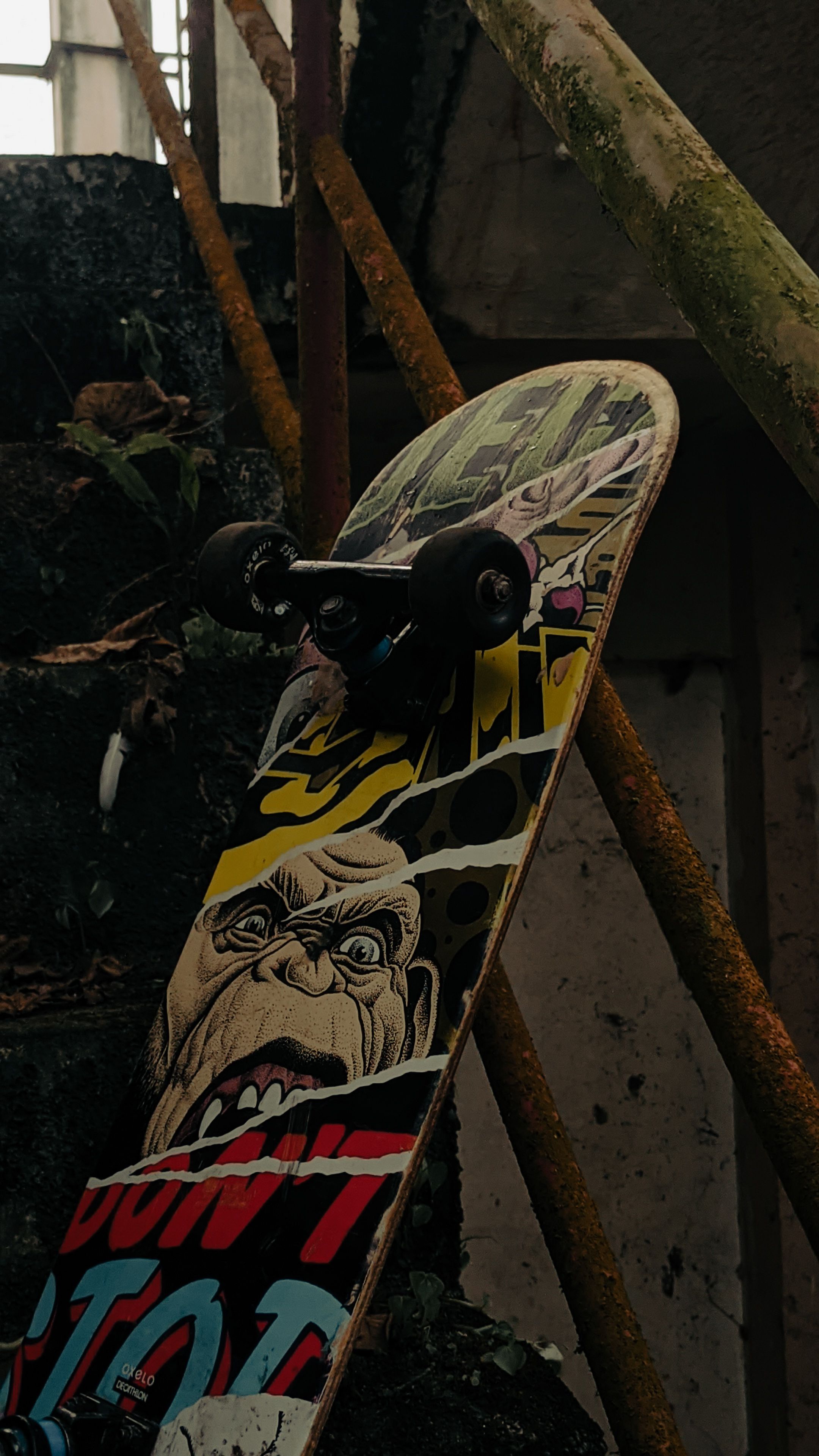 A Skateboard Near the Rusty Metal Railing · Free Stock Photo