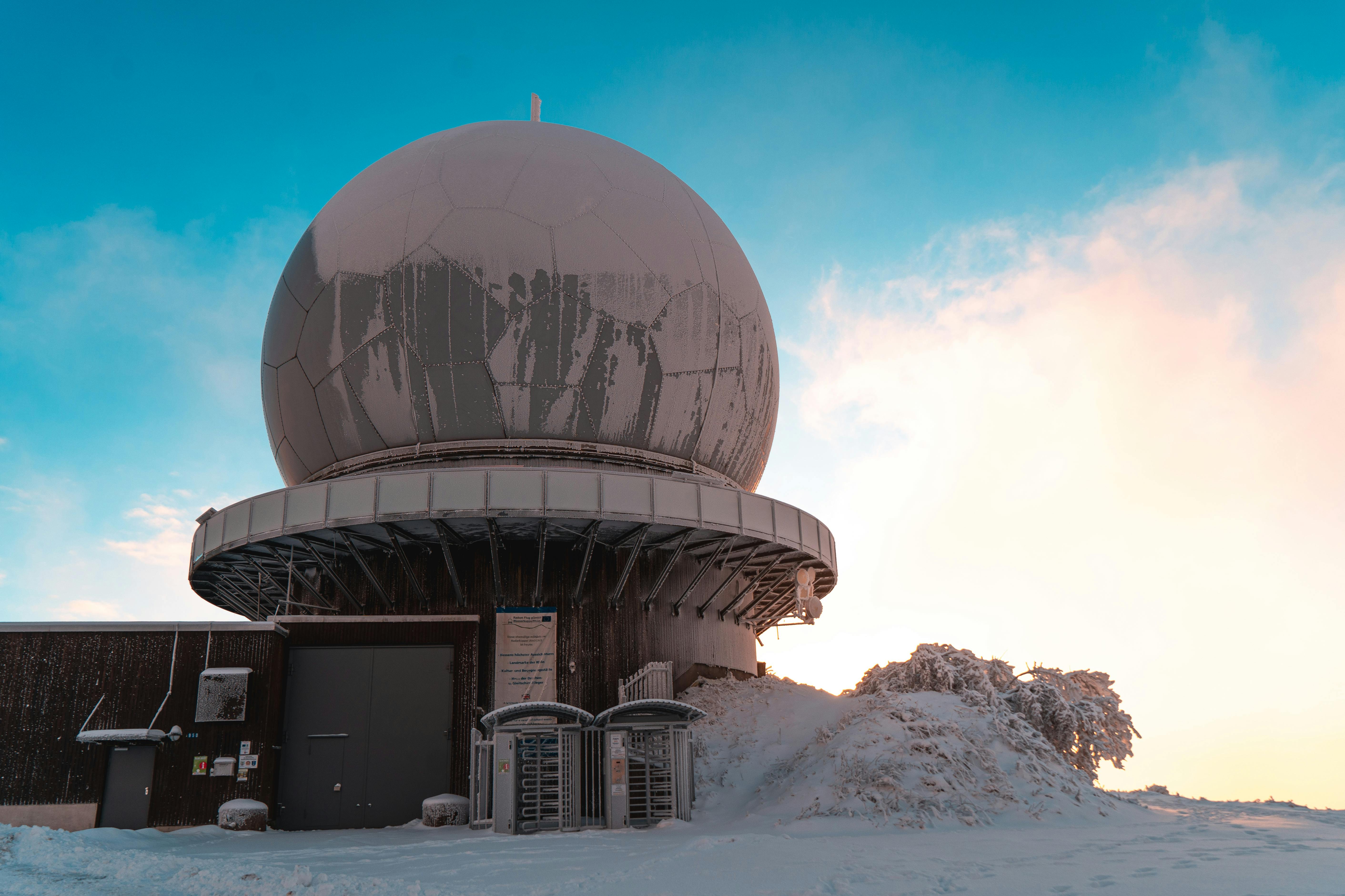 A Gray Concrete Dome Building Covered with Snow · Free Stock Photo