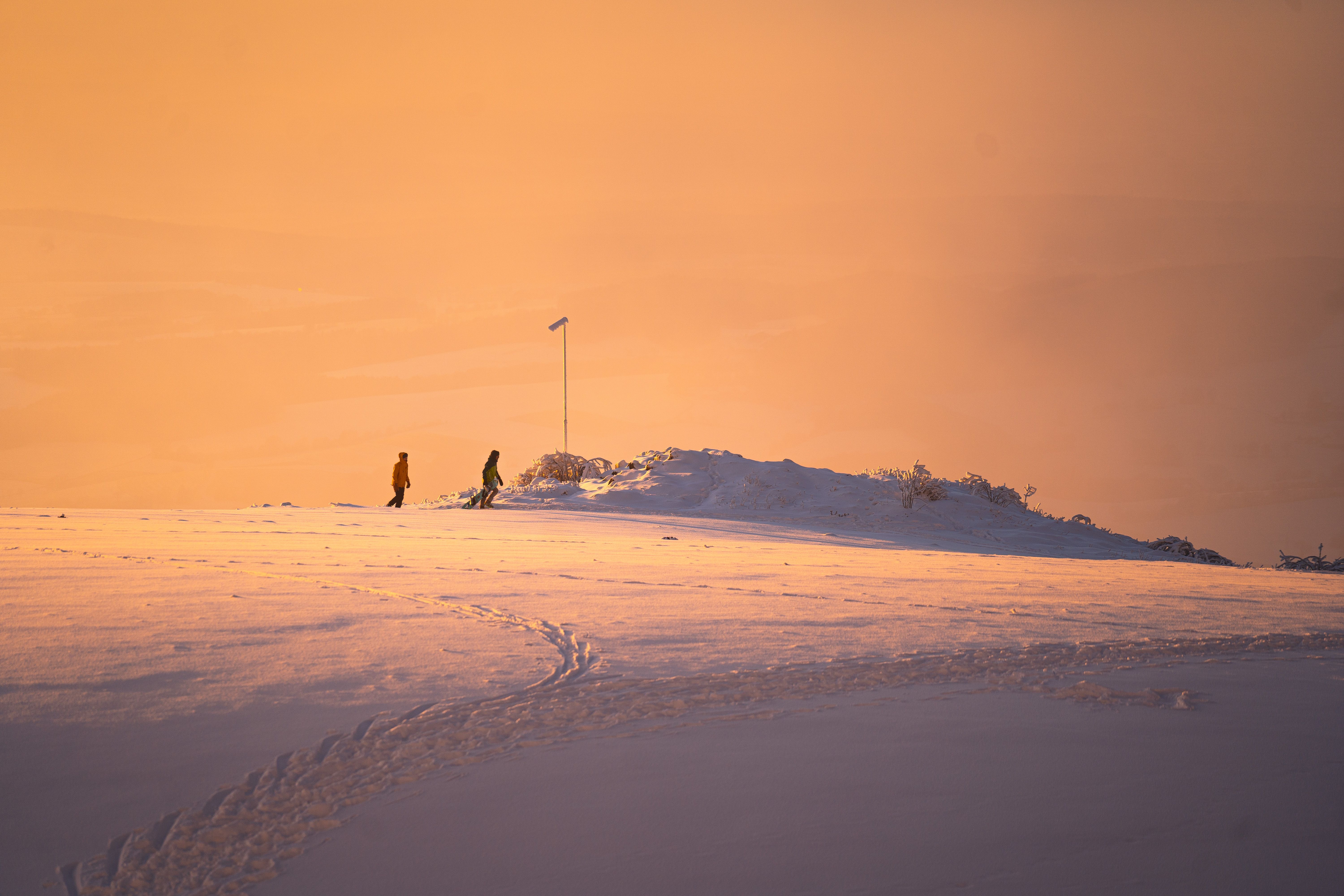 People Walking in Winter Landscape on Sunset · Free Stock Photo