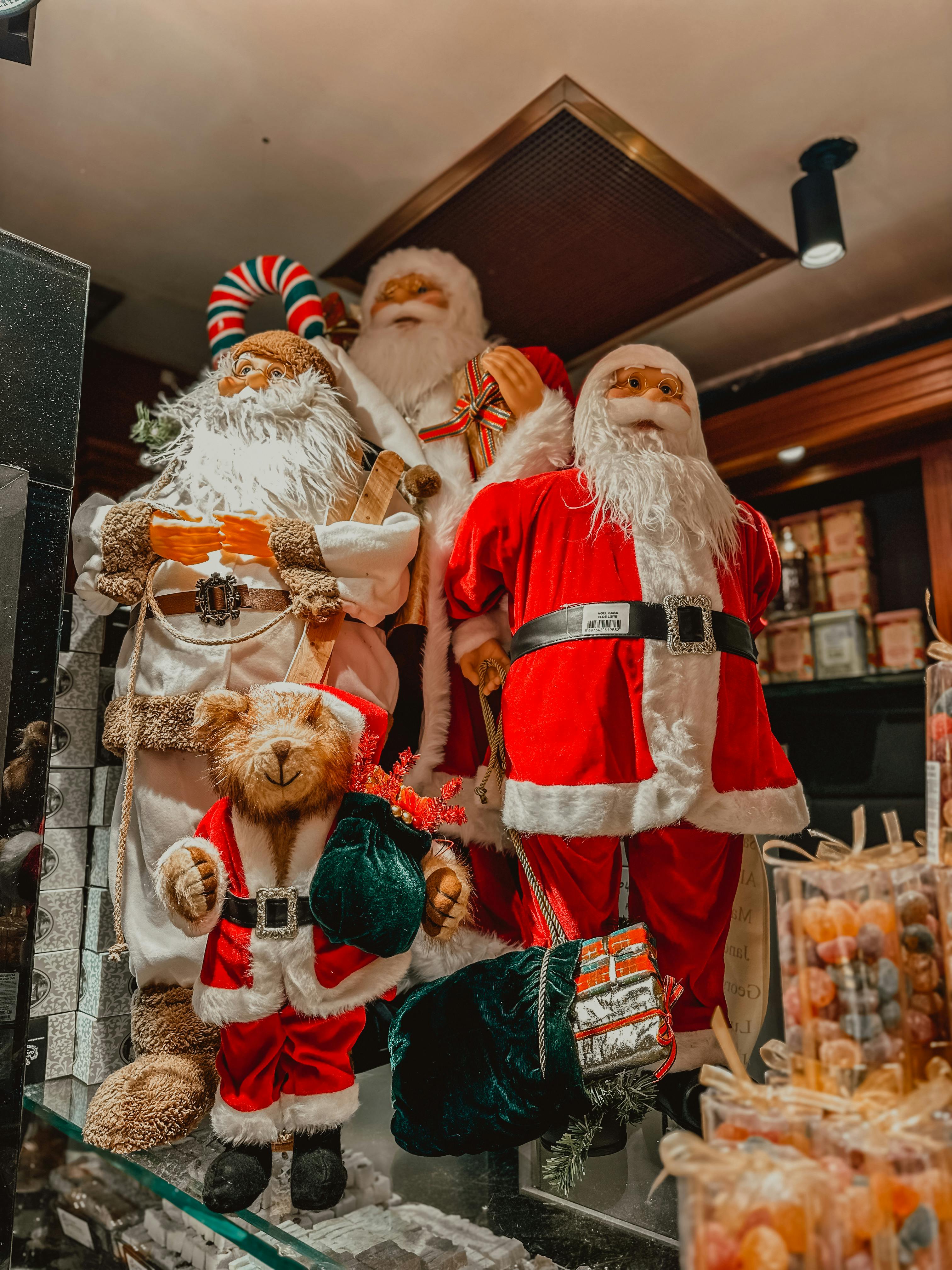 Various Santa Claus Figures in a Candy Store · Free Stock Photo