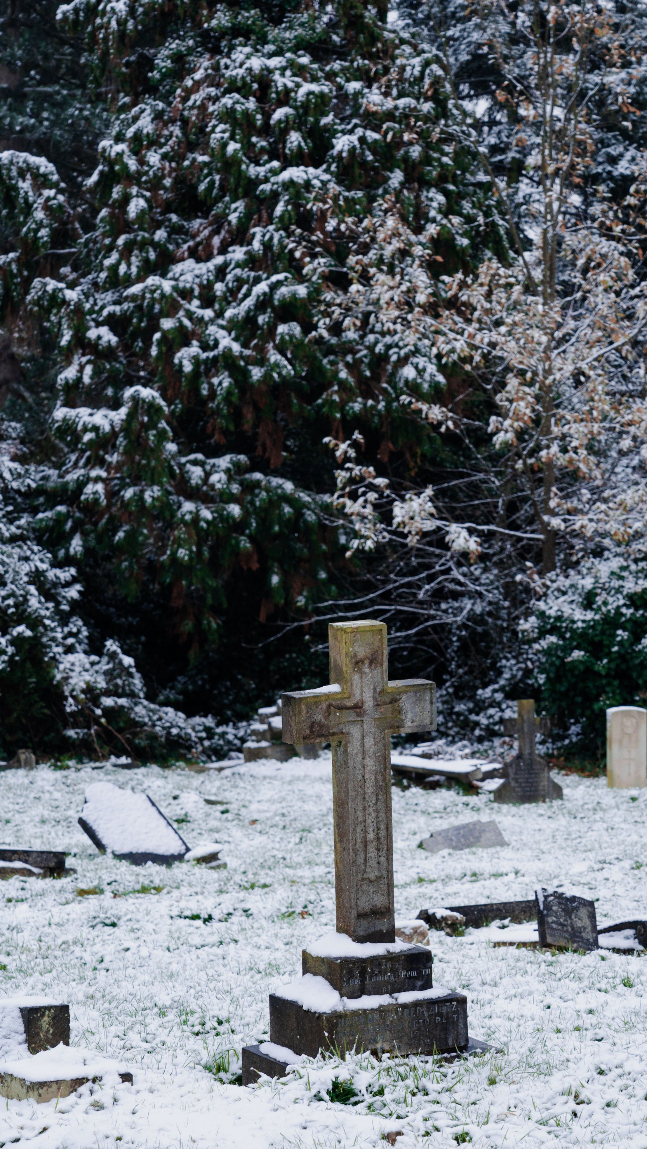 Flowers on a Cross Gravestone · Free Stock Photo