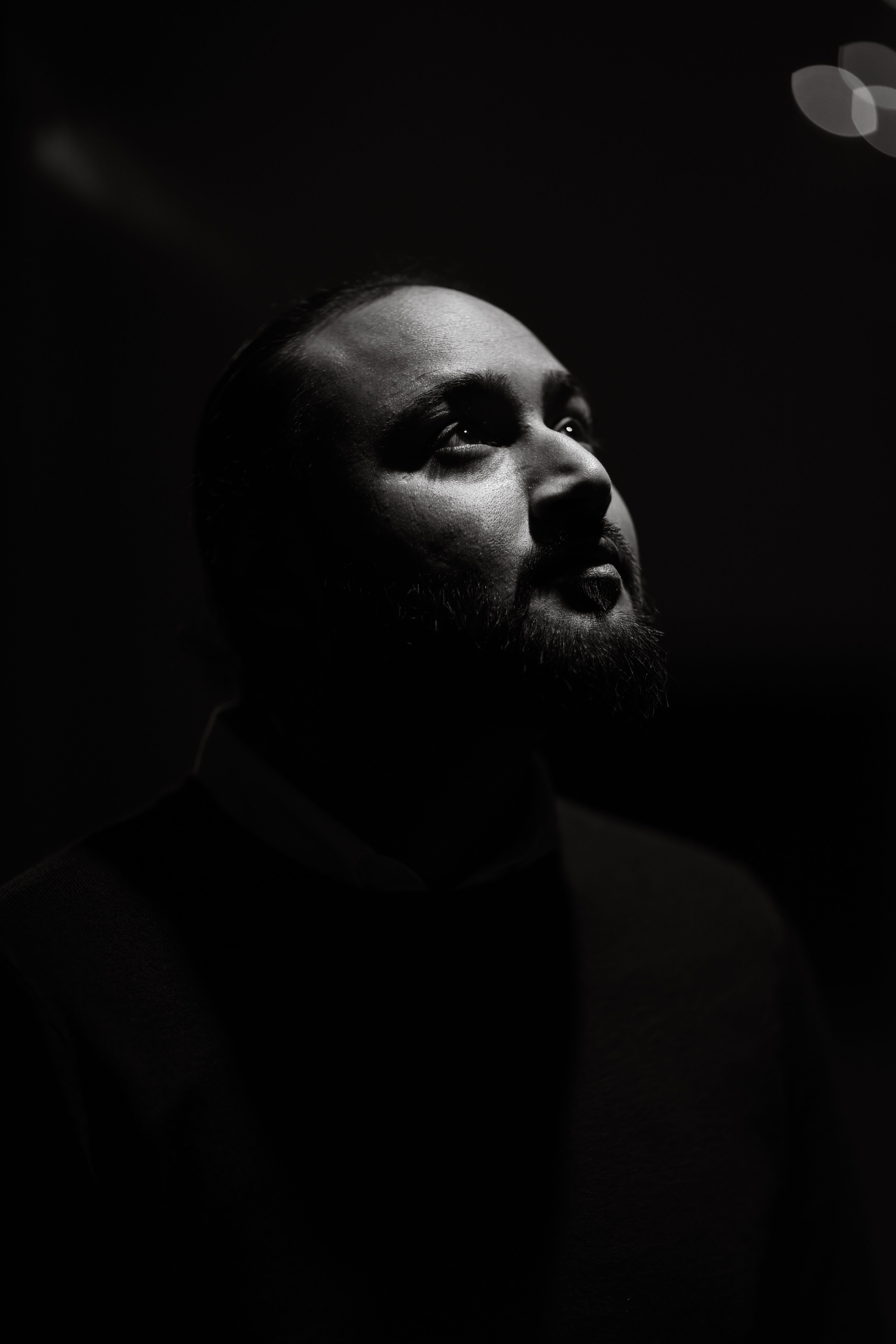 Grayscale Photo of a Man Looking at Camera · Free Stock Photo