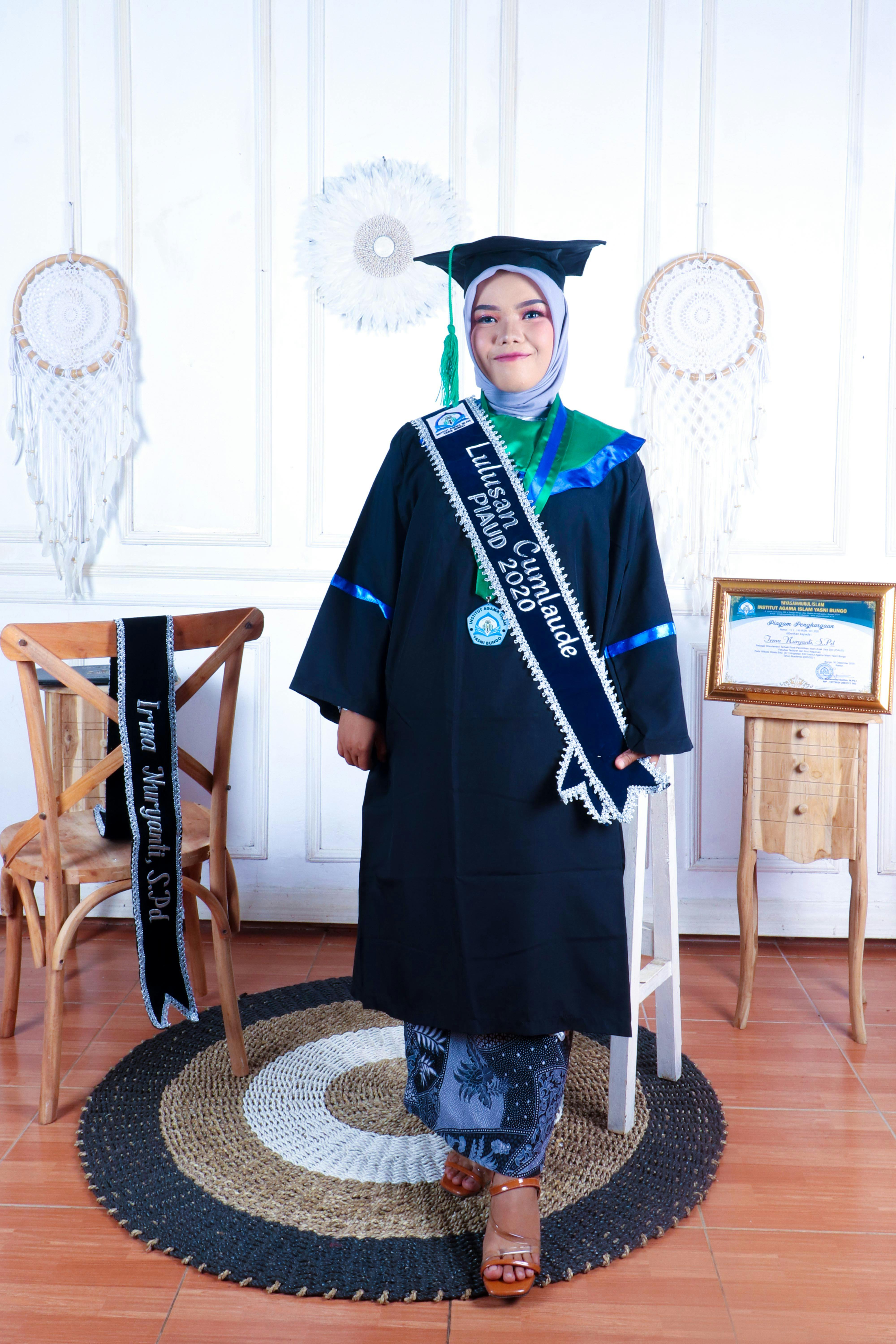 Woman in Graduation Gown · Free Stock Photo
