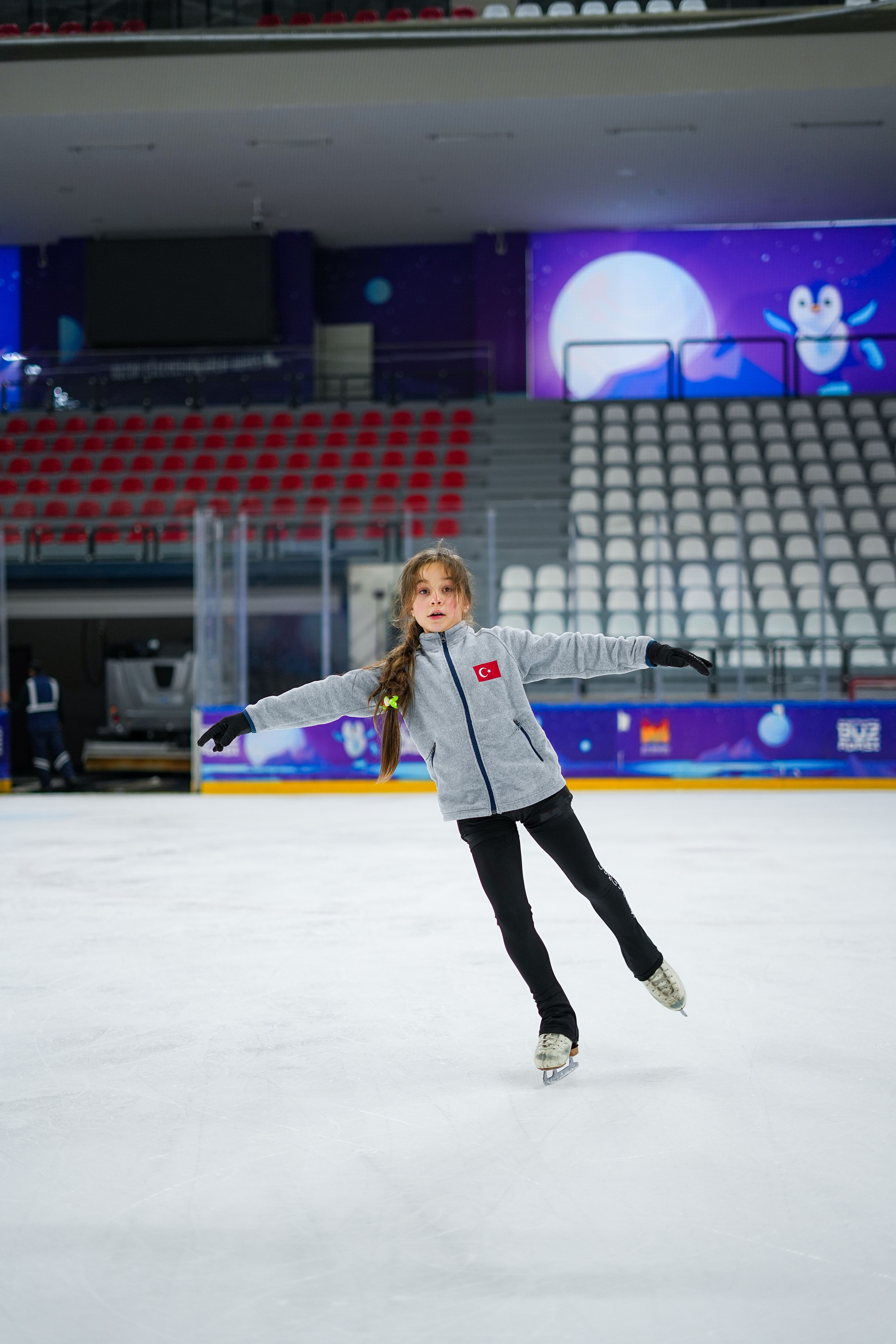 Girl Ice Skating in Turkish Team Jacket · Free Stock Photo