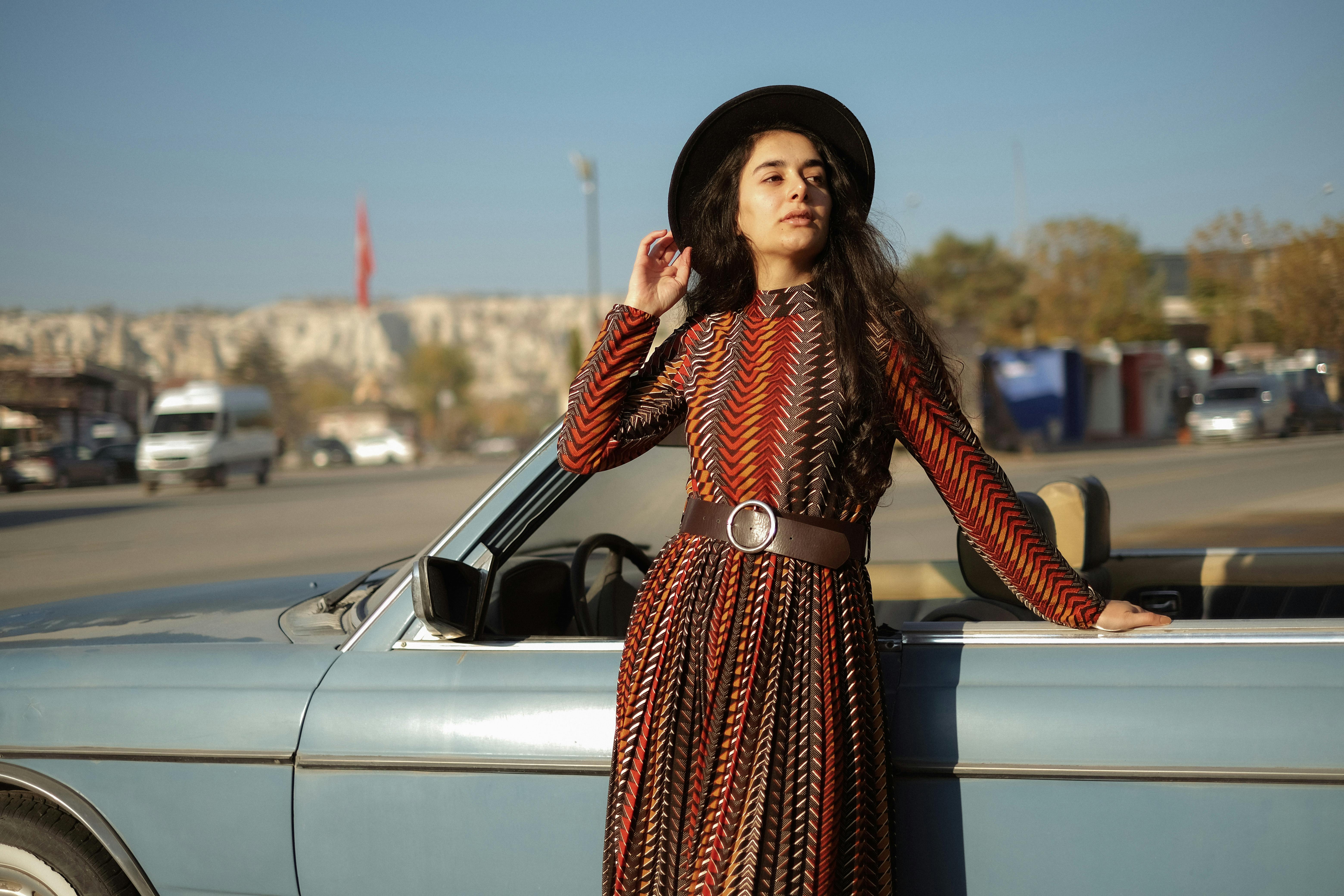 Fashionable Woman Posing on Classic Car · Free Stock Photo