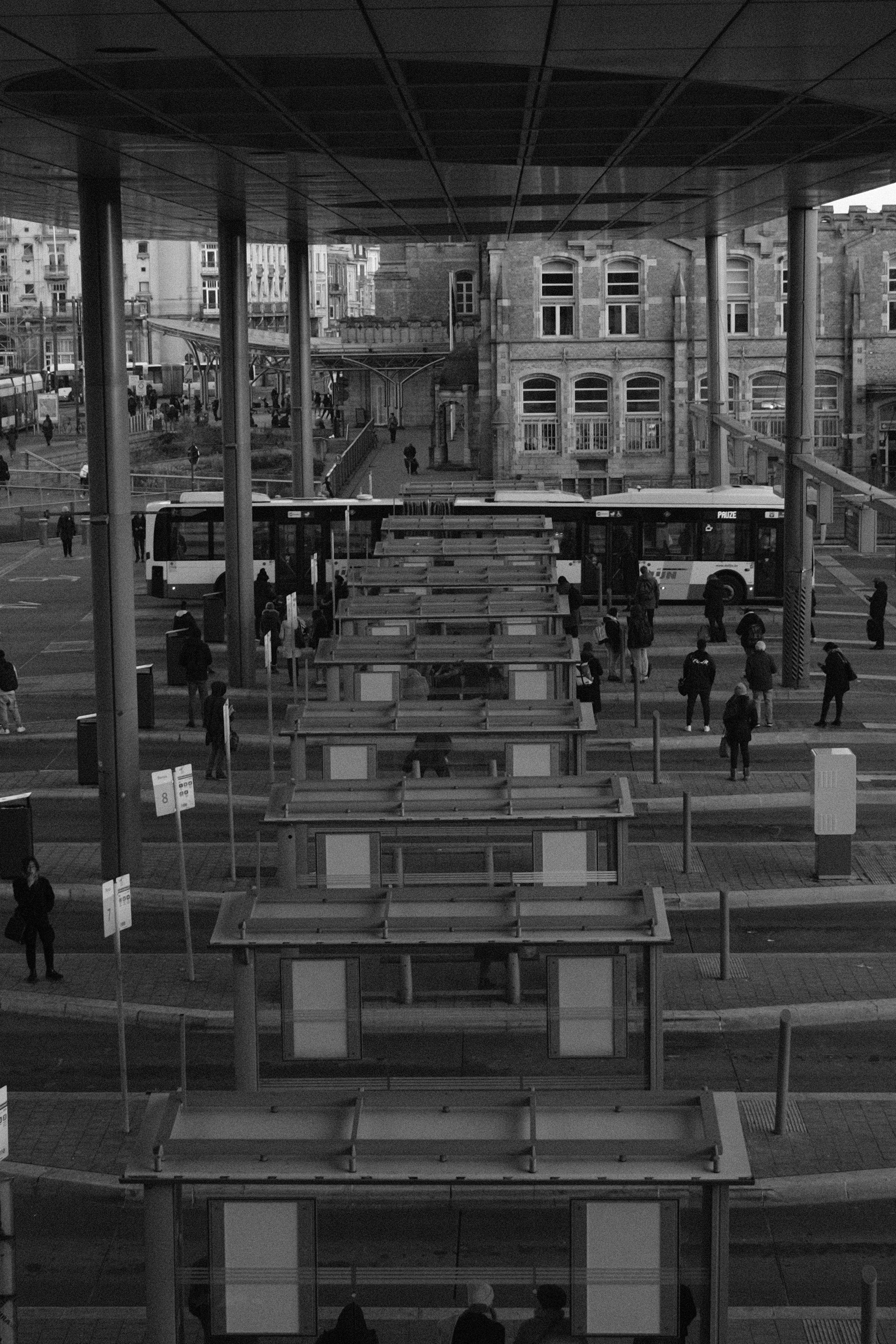 Grayscale Photo of a Bus Stop · Free Stock Photo