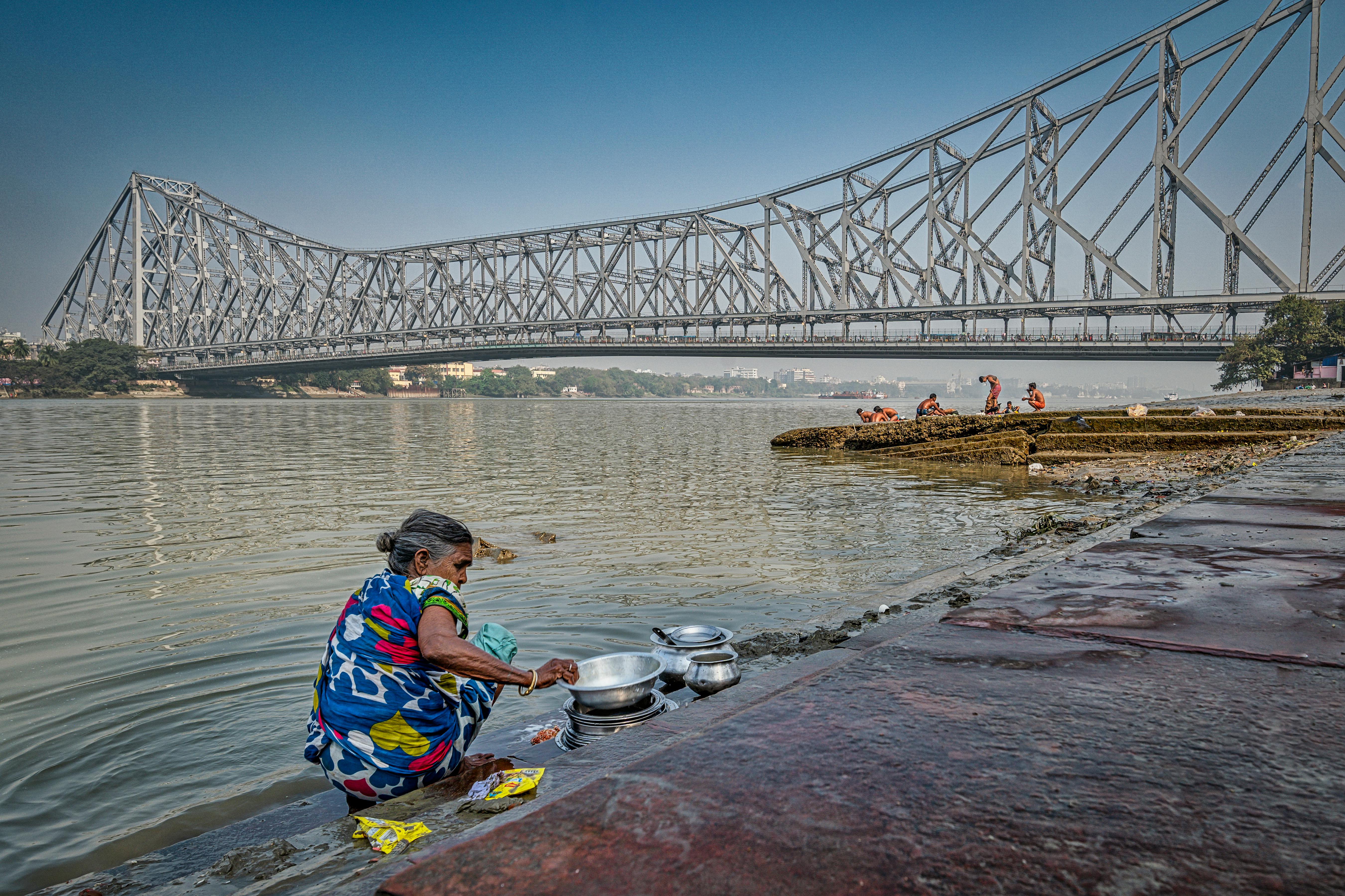 Woman Washing Dishes in Hooghly River · Free Stock Photo