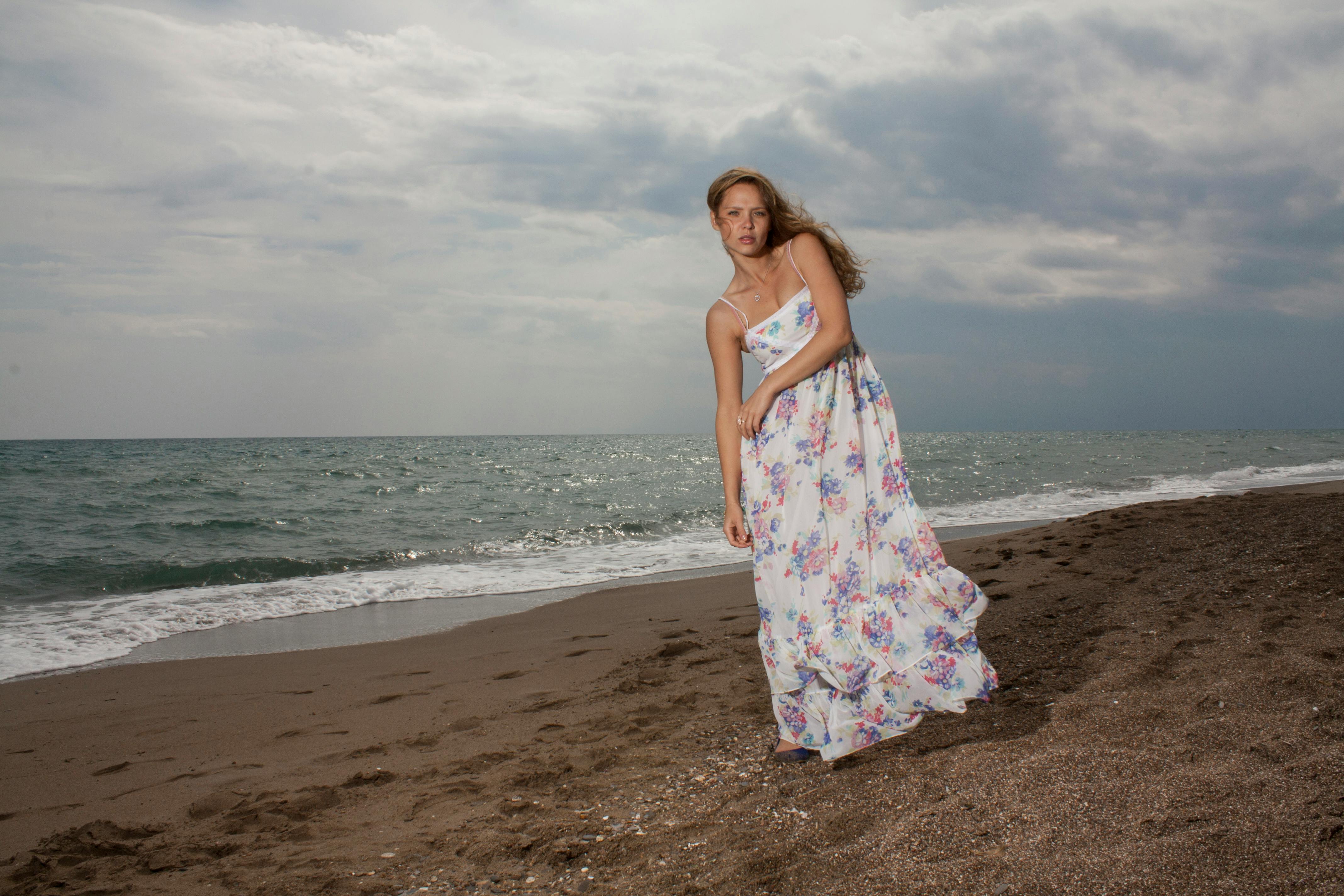 Woman Standing On Seashore · Free Stock Photo