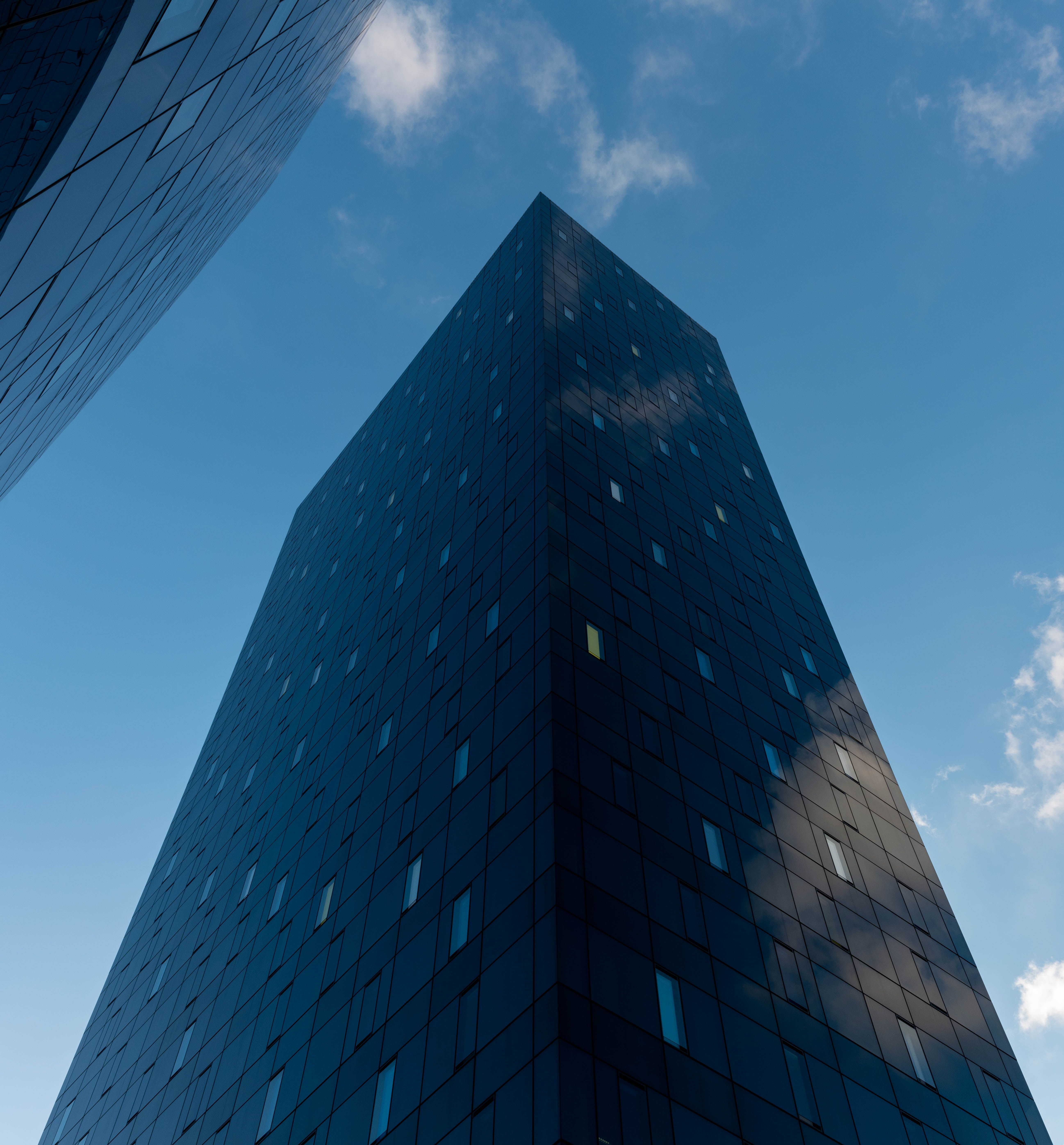 Gray High-rise Building Under Blue and White Sky · Free Stock Photo