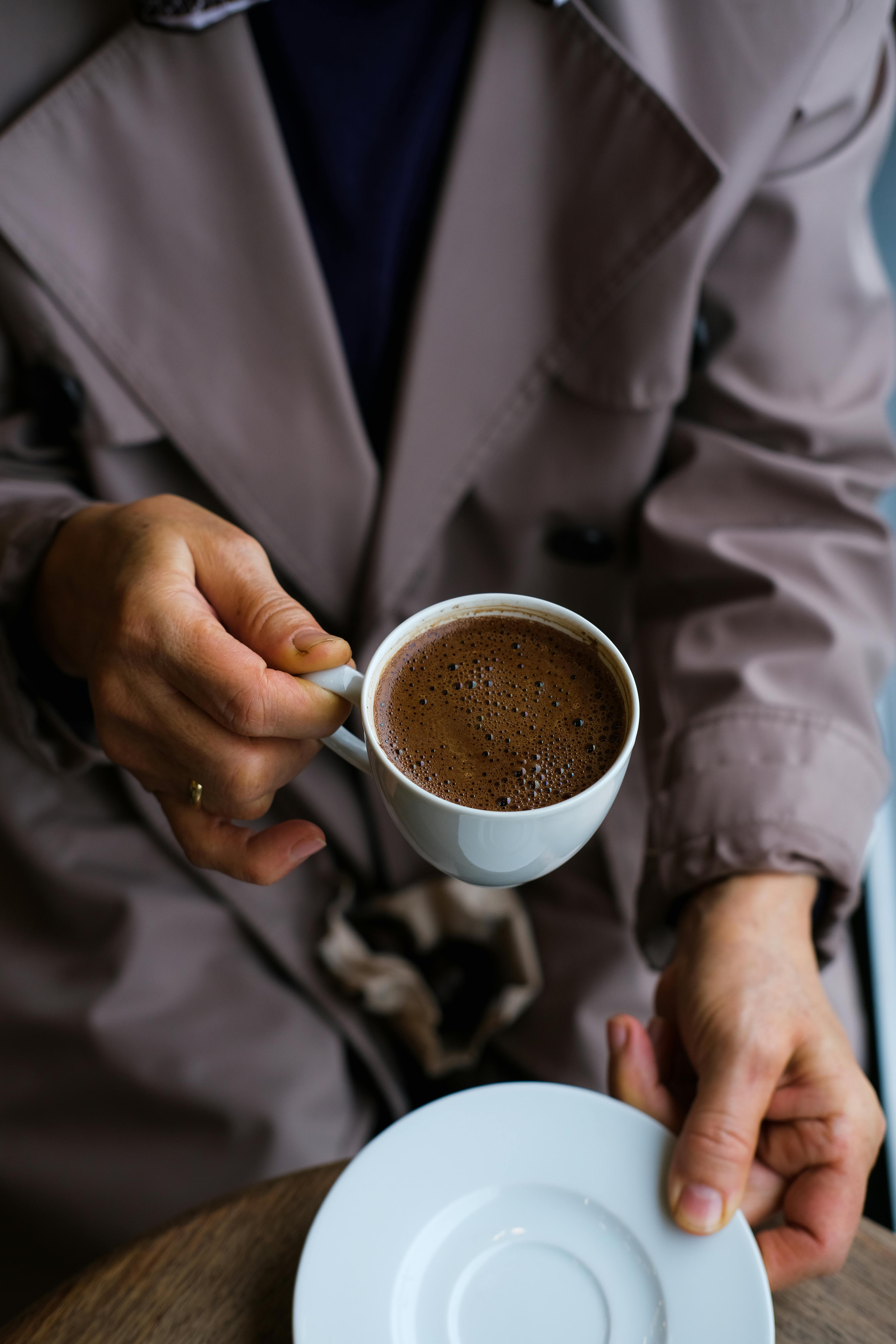 Hands Holding Coffee Cup and Plate · Free Stock Photo