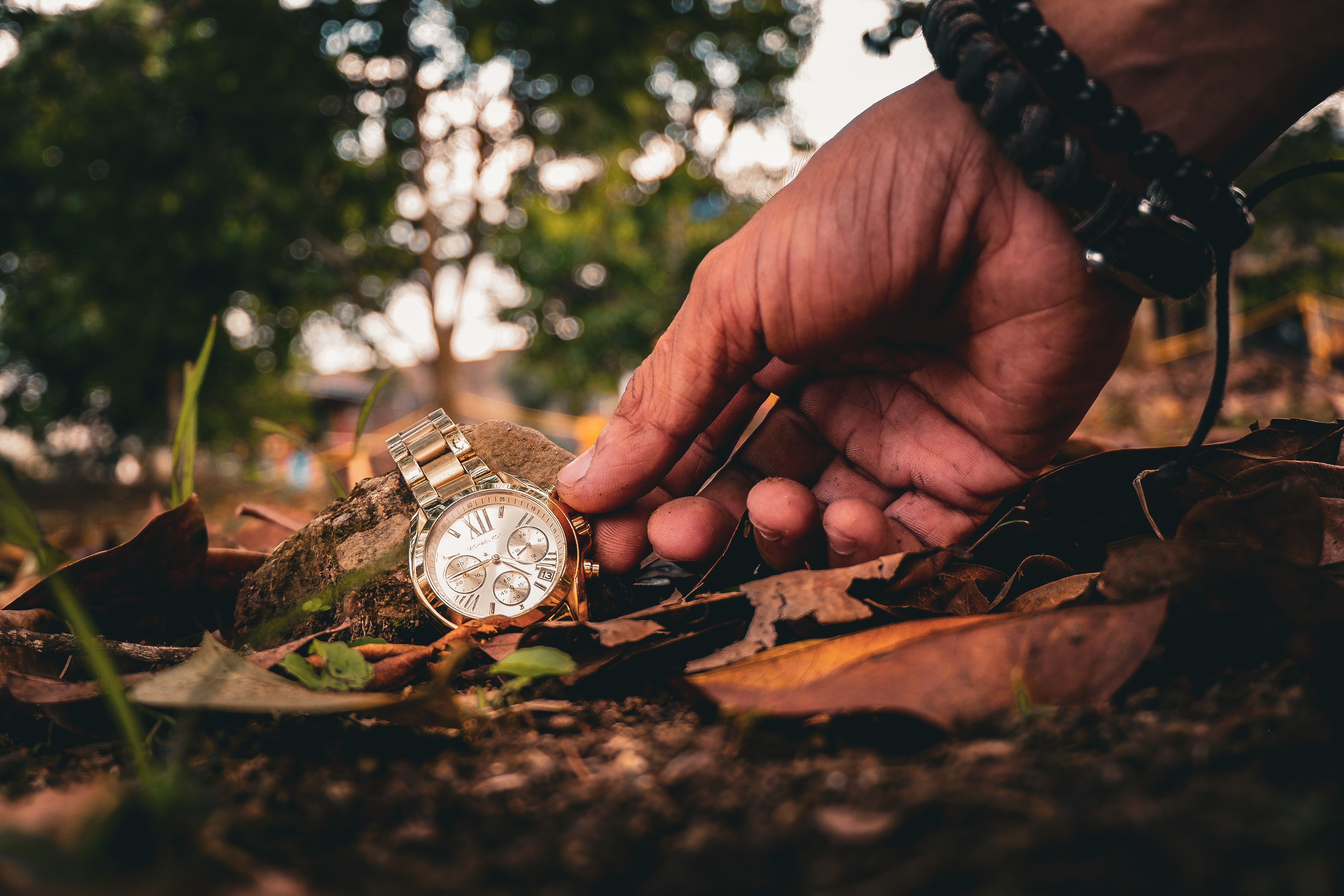 Selective Focus Photography of Chronograph Watch on Rock · Free Stock Photo