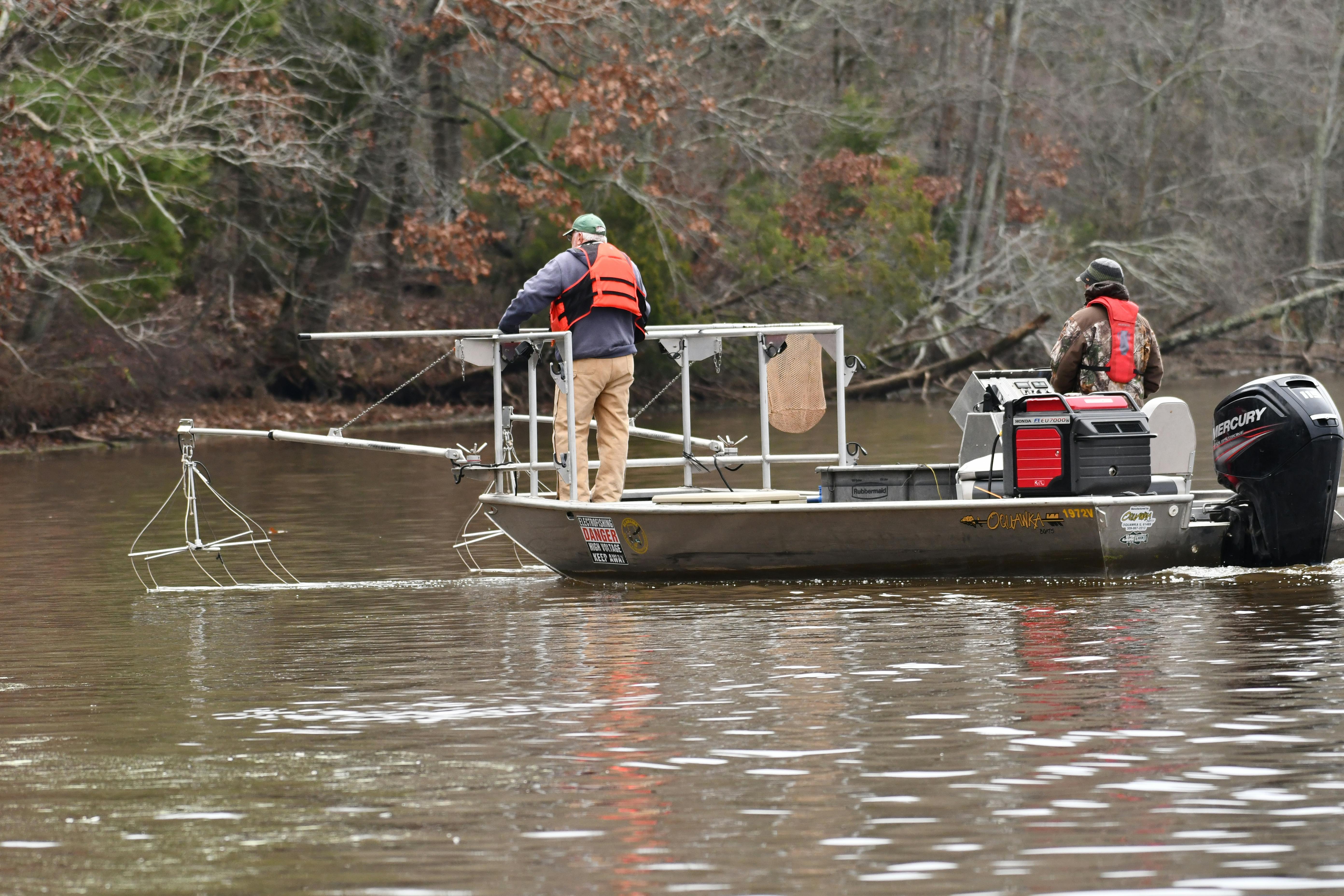 Men Fishing on a Boat · Free Stock Photo