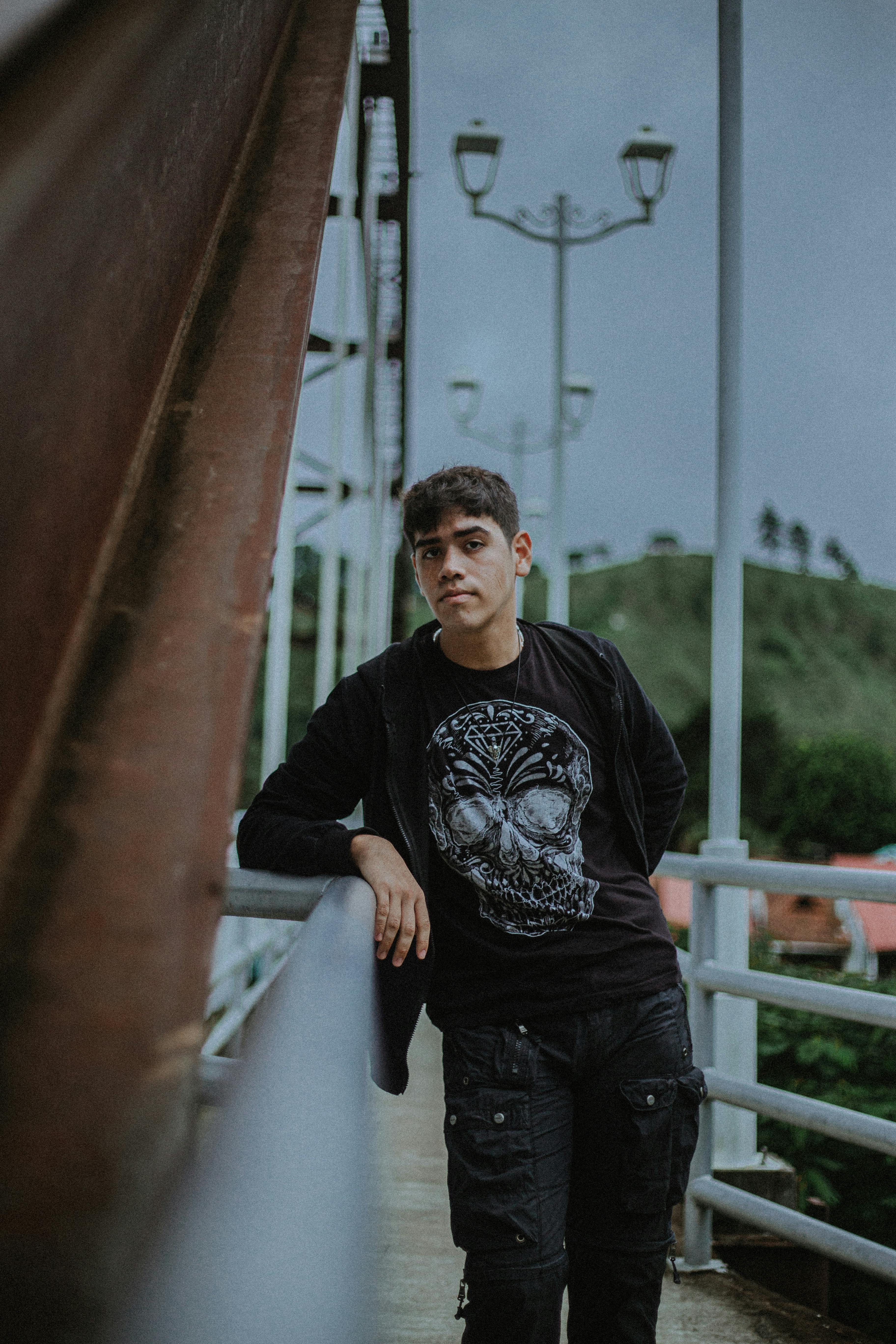 Man Laying on Staircase Railing · Free Stock Photo