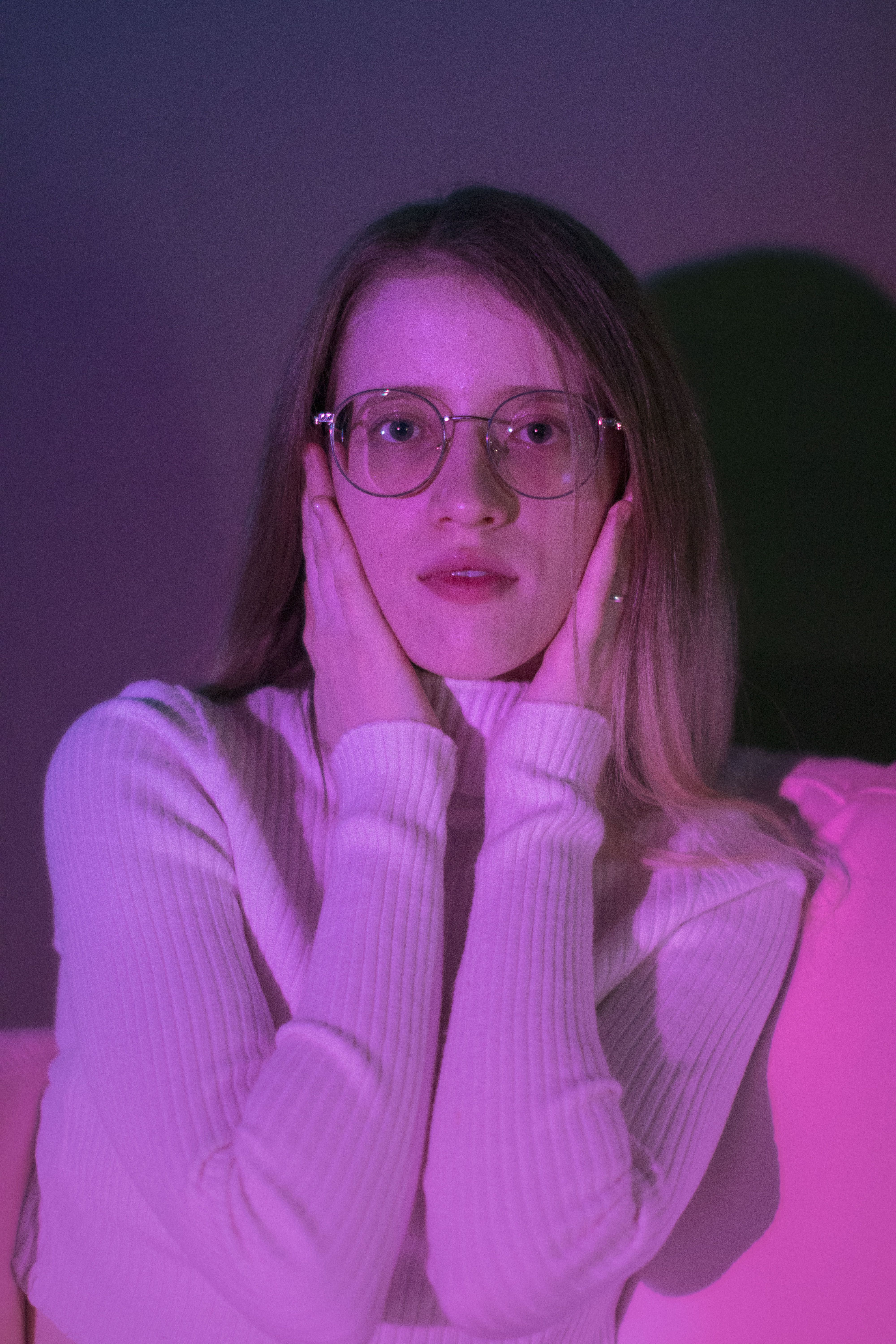 Portrait of a Woman Under a Pink Light · Free Stock Photo