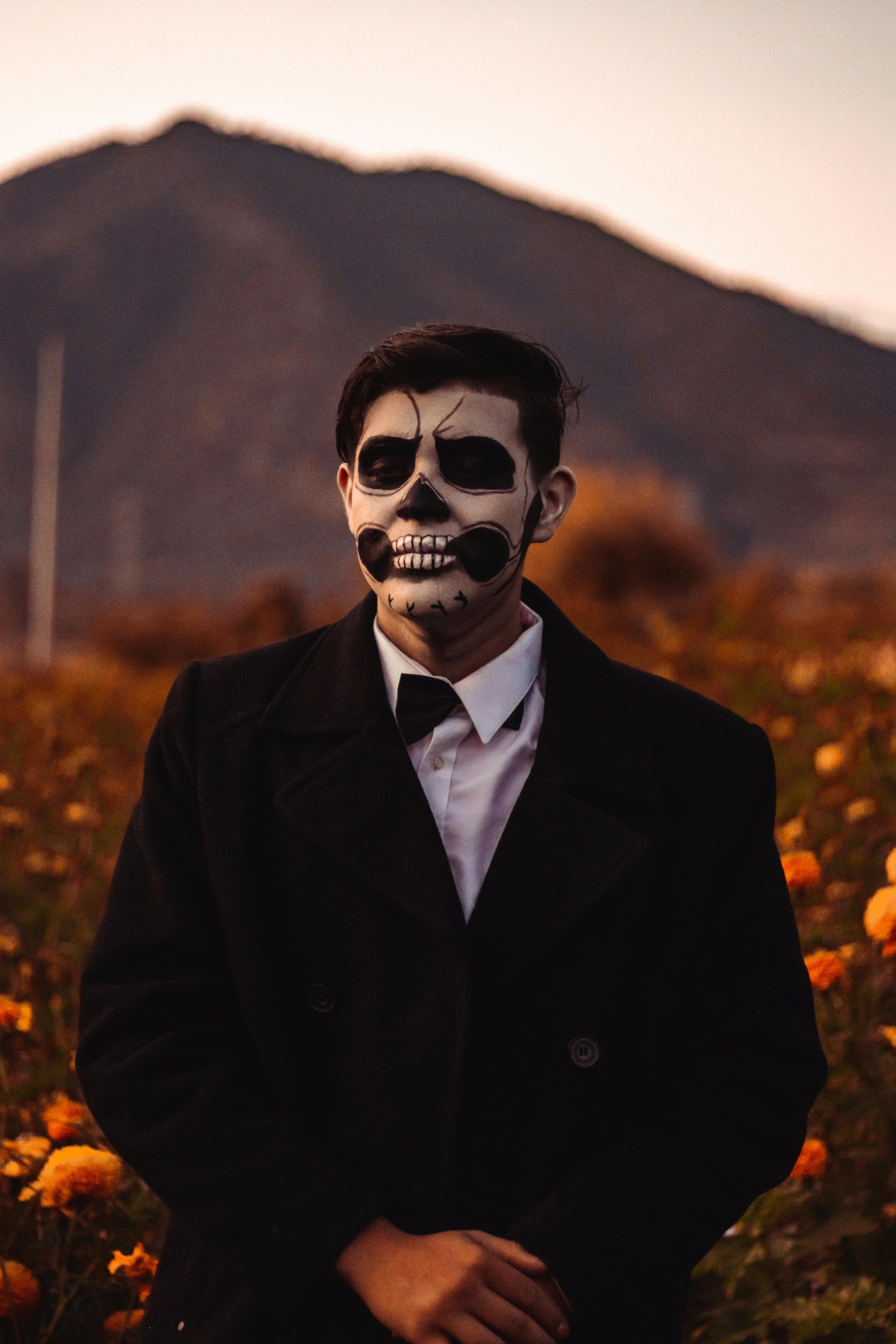 Photo of a Mann with Painted Death Mask · Free Stock Photo