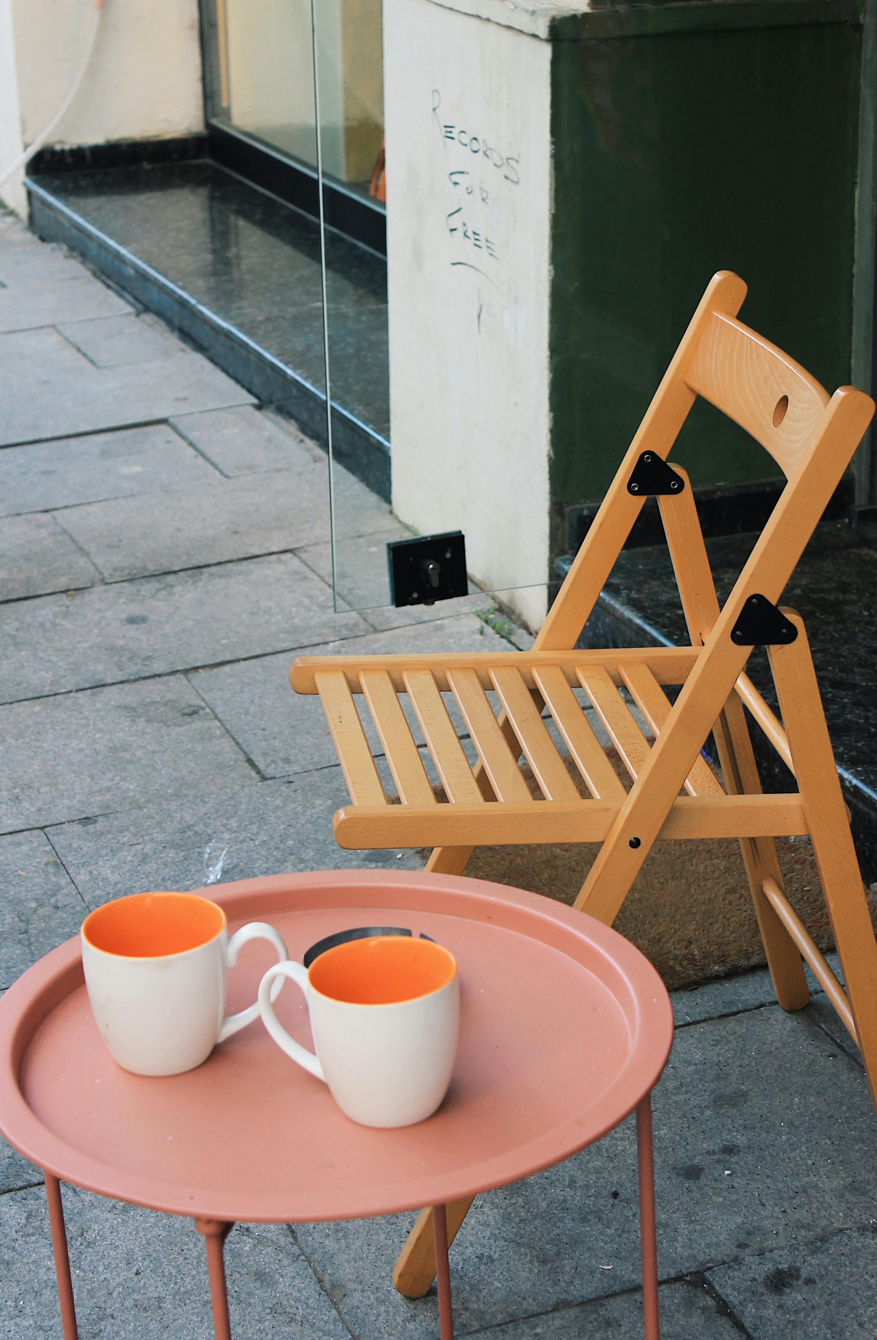 Wooden Chair and Cups on the Side Table · Free Stock Photo