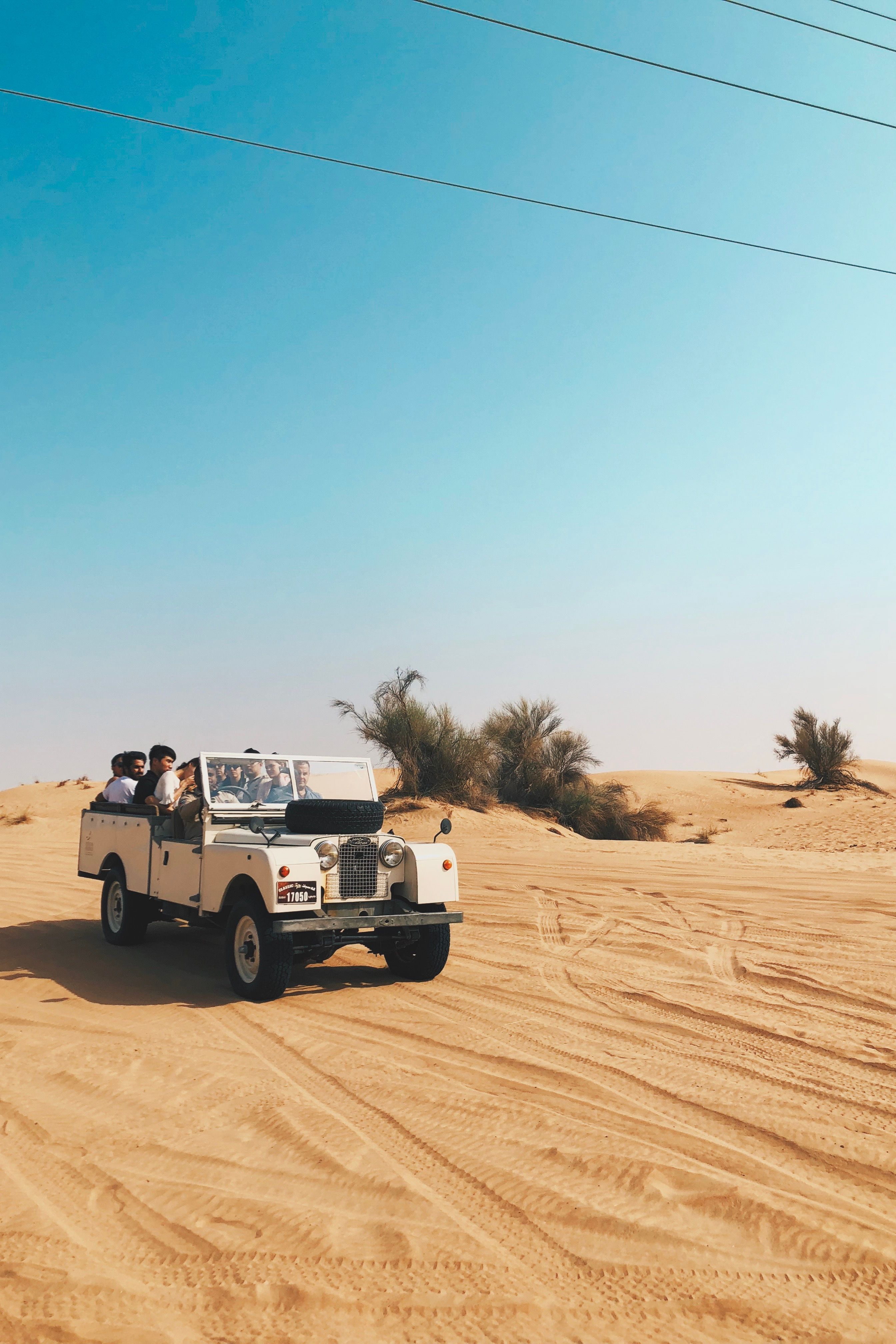 People Riding Vehicle on Desert · Free Stock Photo