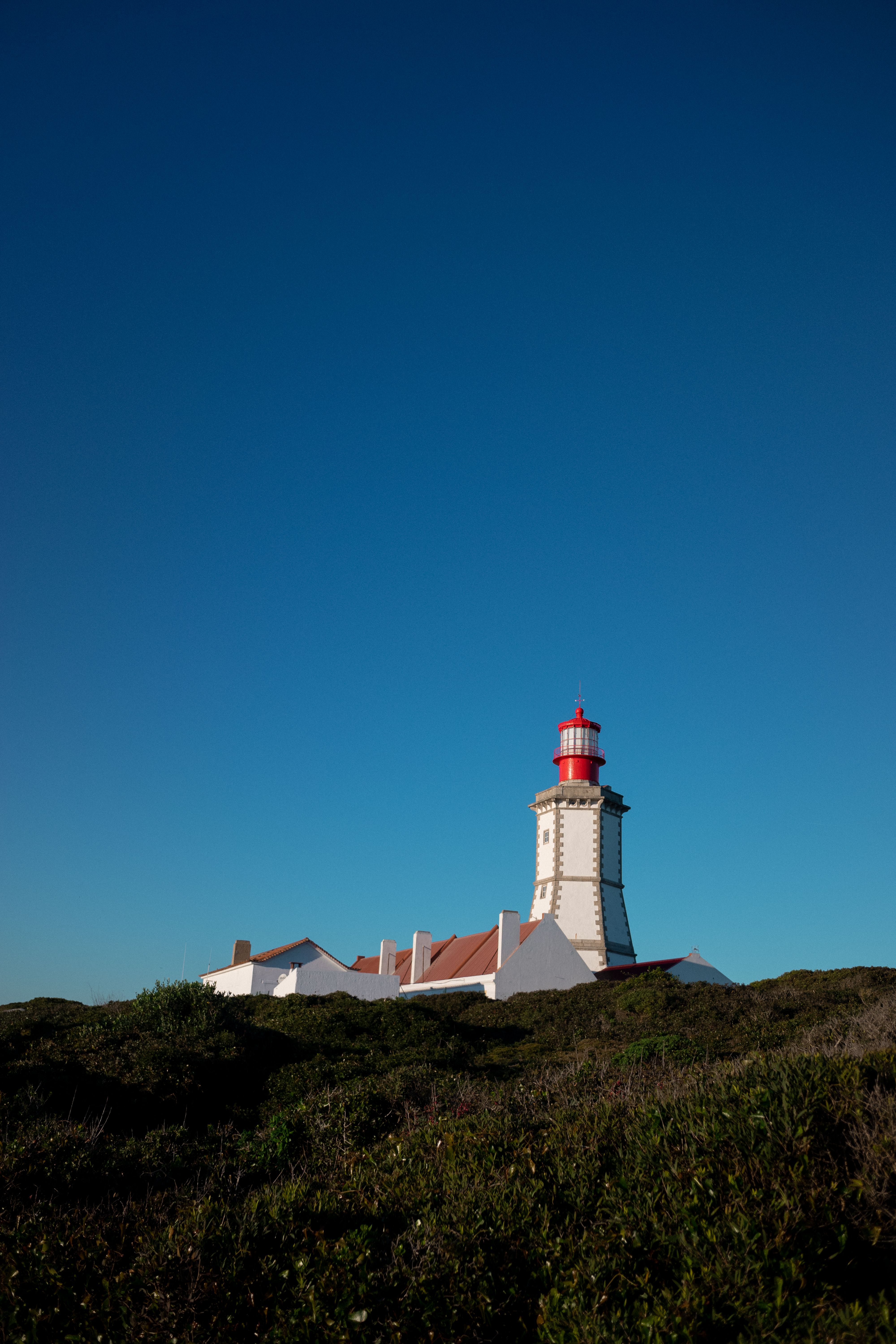 Iconic Cape Agulhas Lighthouse against Blue Sky · Free Stock Photo