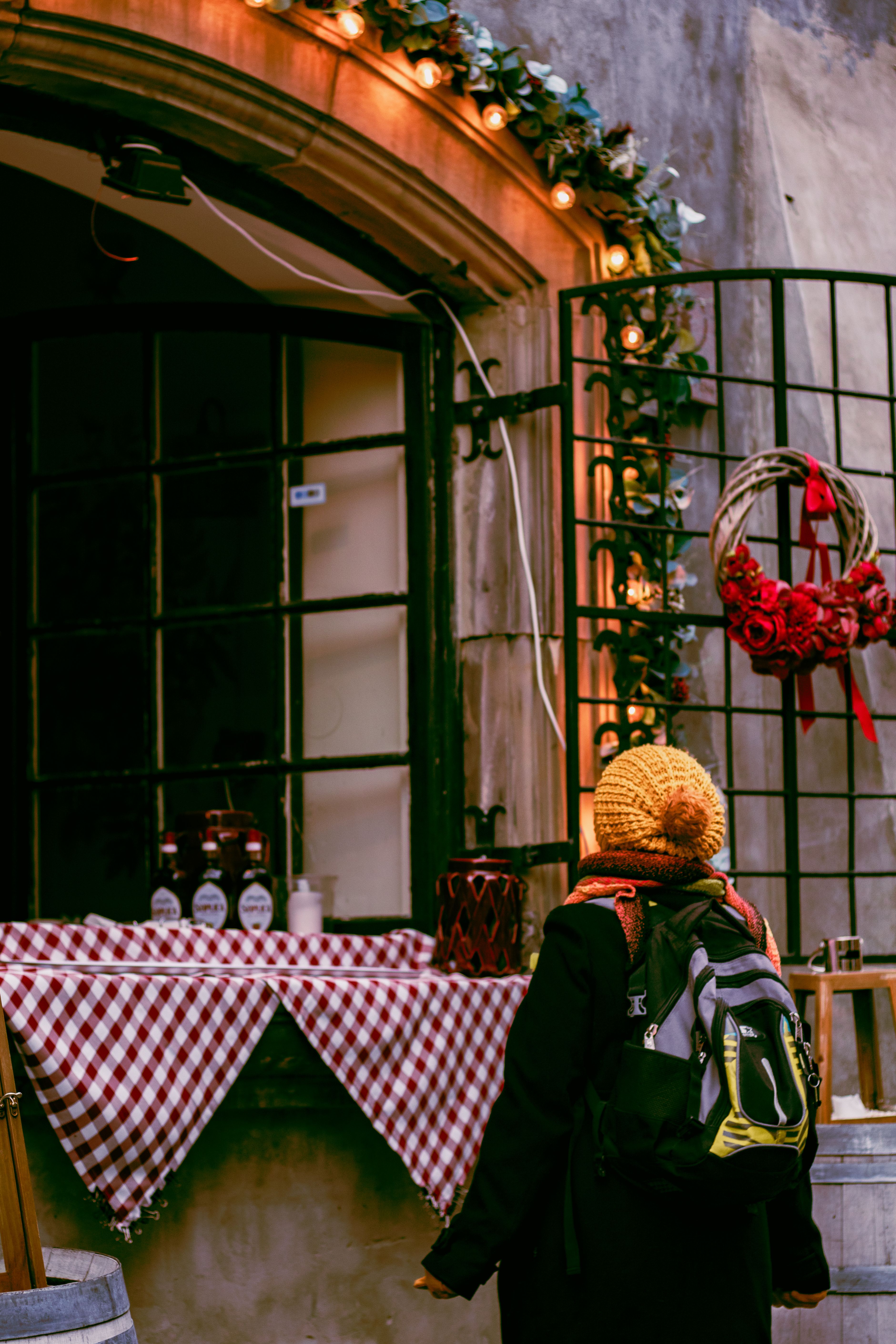 Woman near Decorated for Christmas Cafe Window · Free Stock Photo