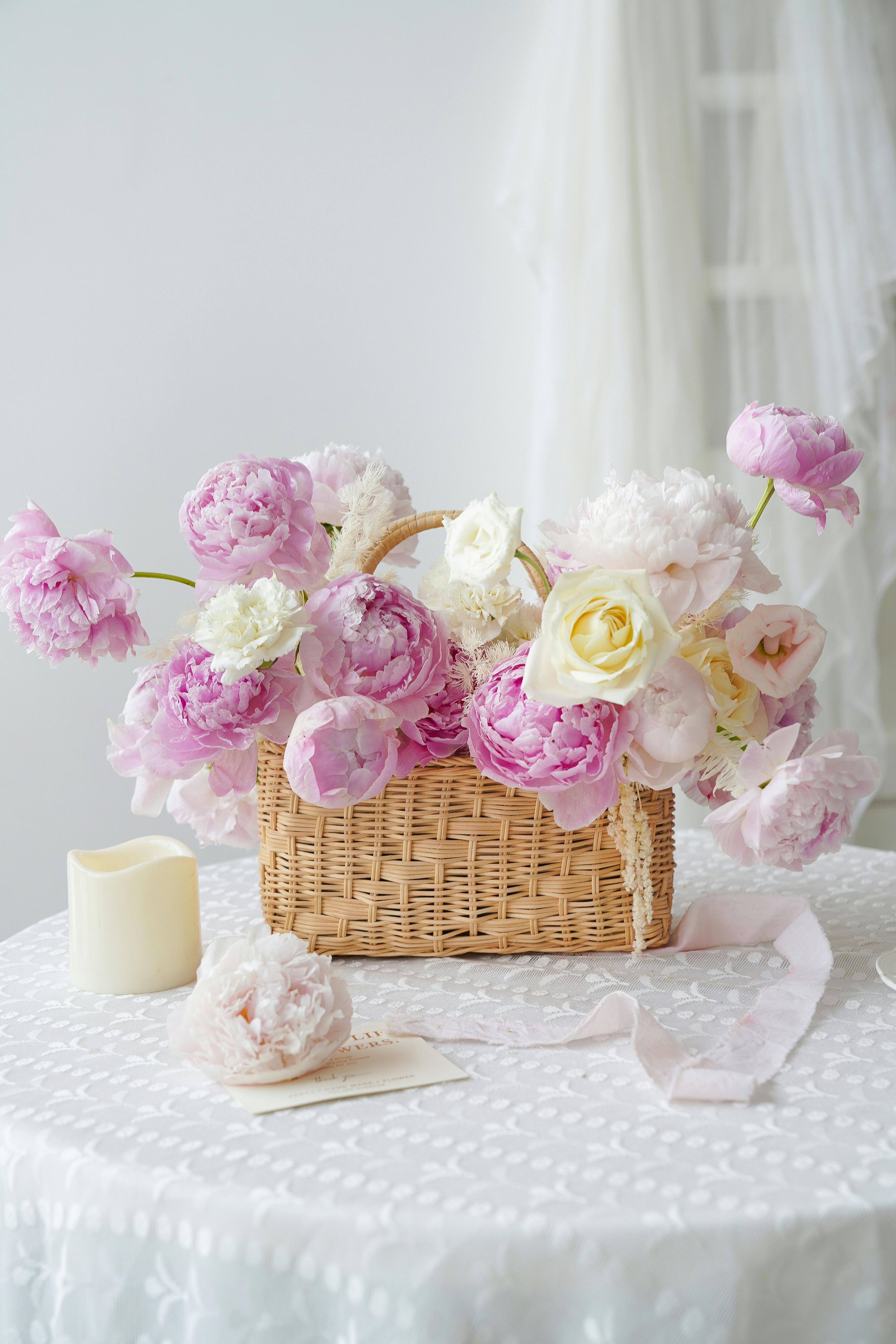 Delicate Flower Arrangement in Basket · Free Stock Photo