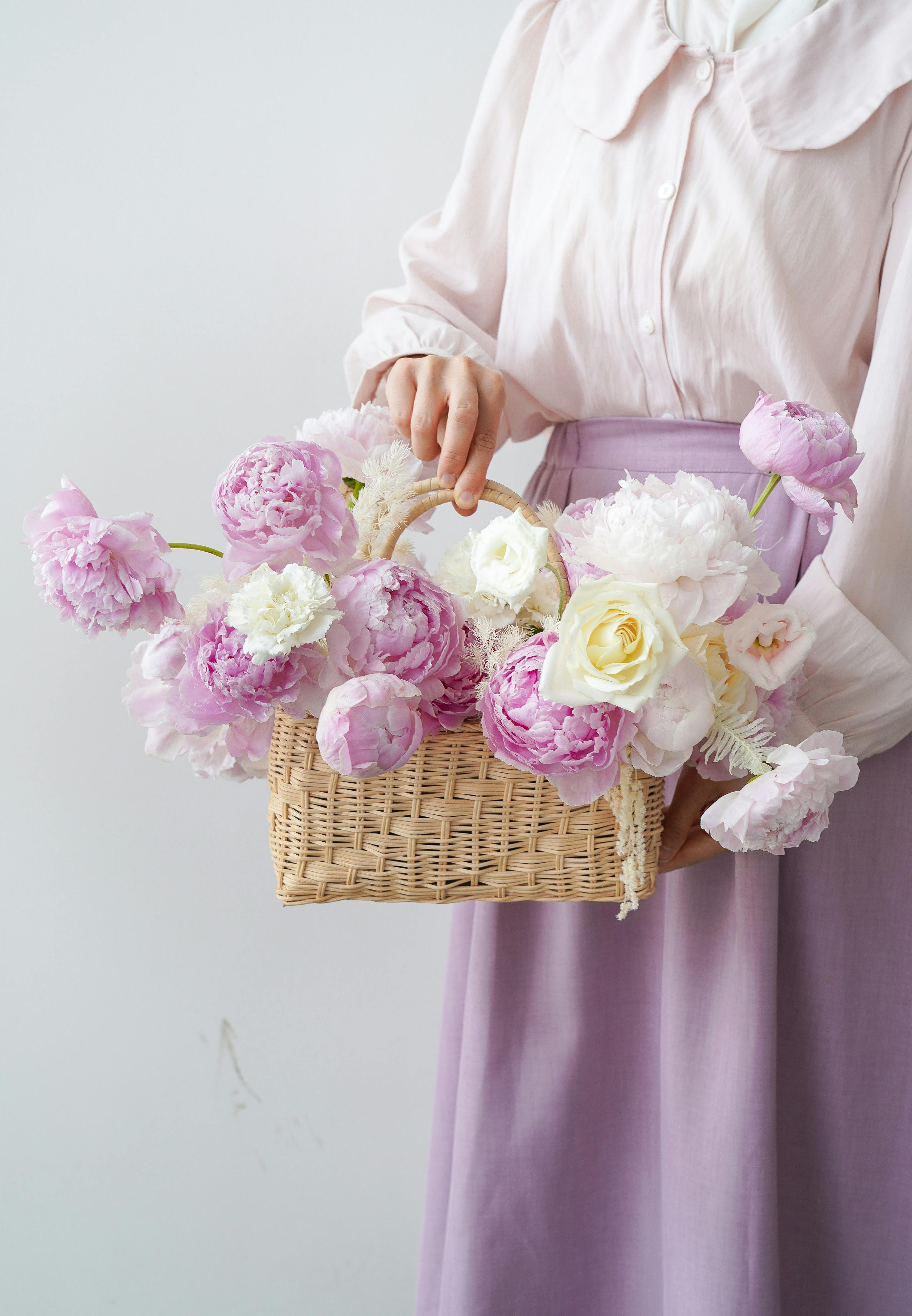 Delicate Flower Arrangement in Basket · Free Stock Photo