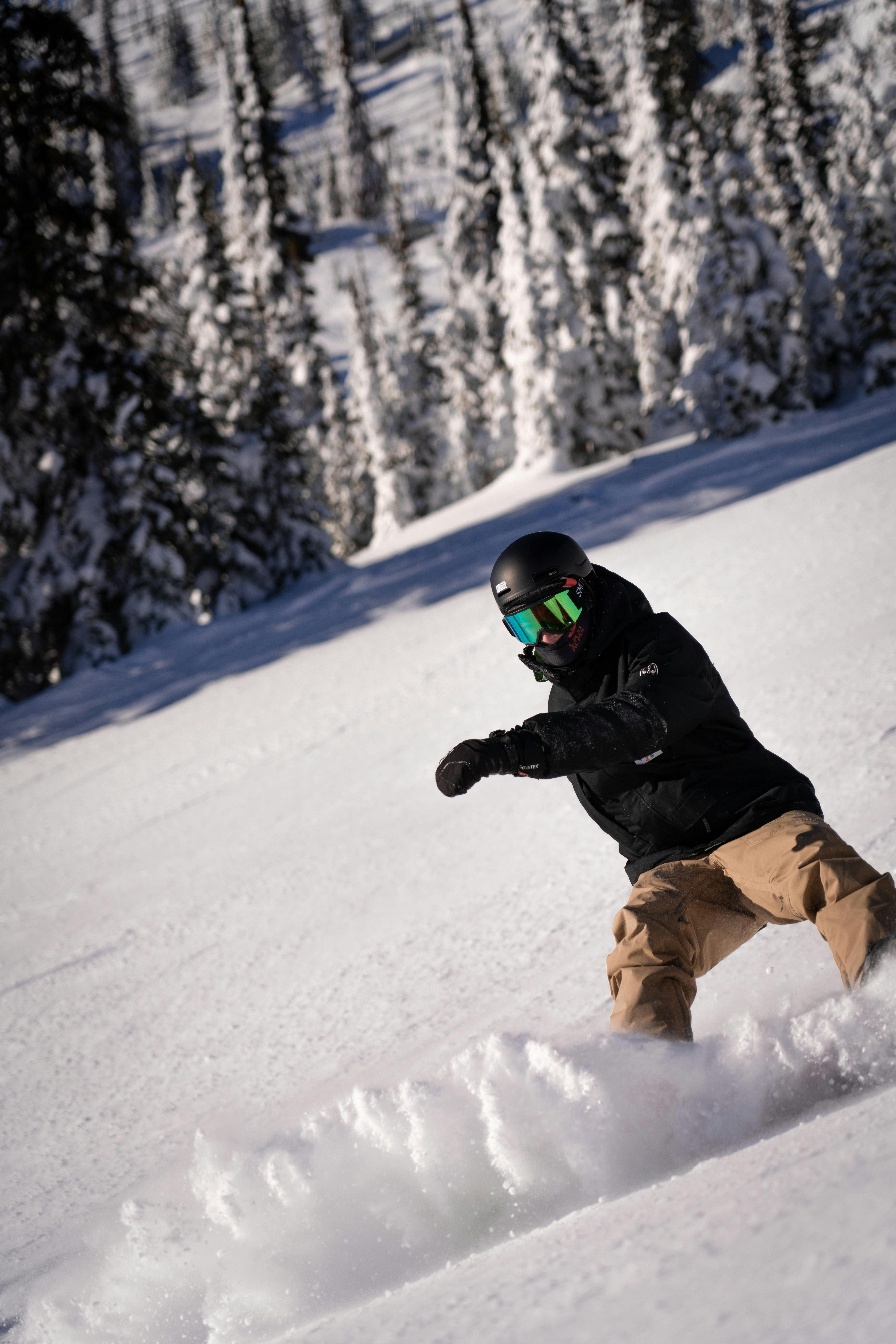 A Couple on a Slope Holding Their Snowboards · Free Stock Photo