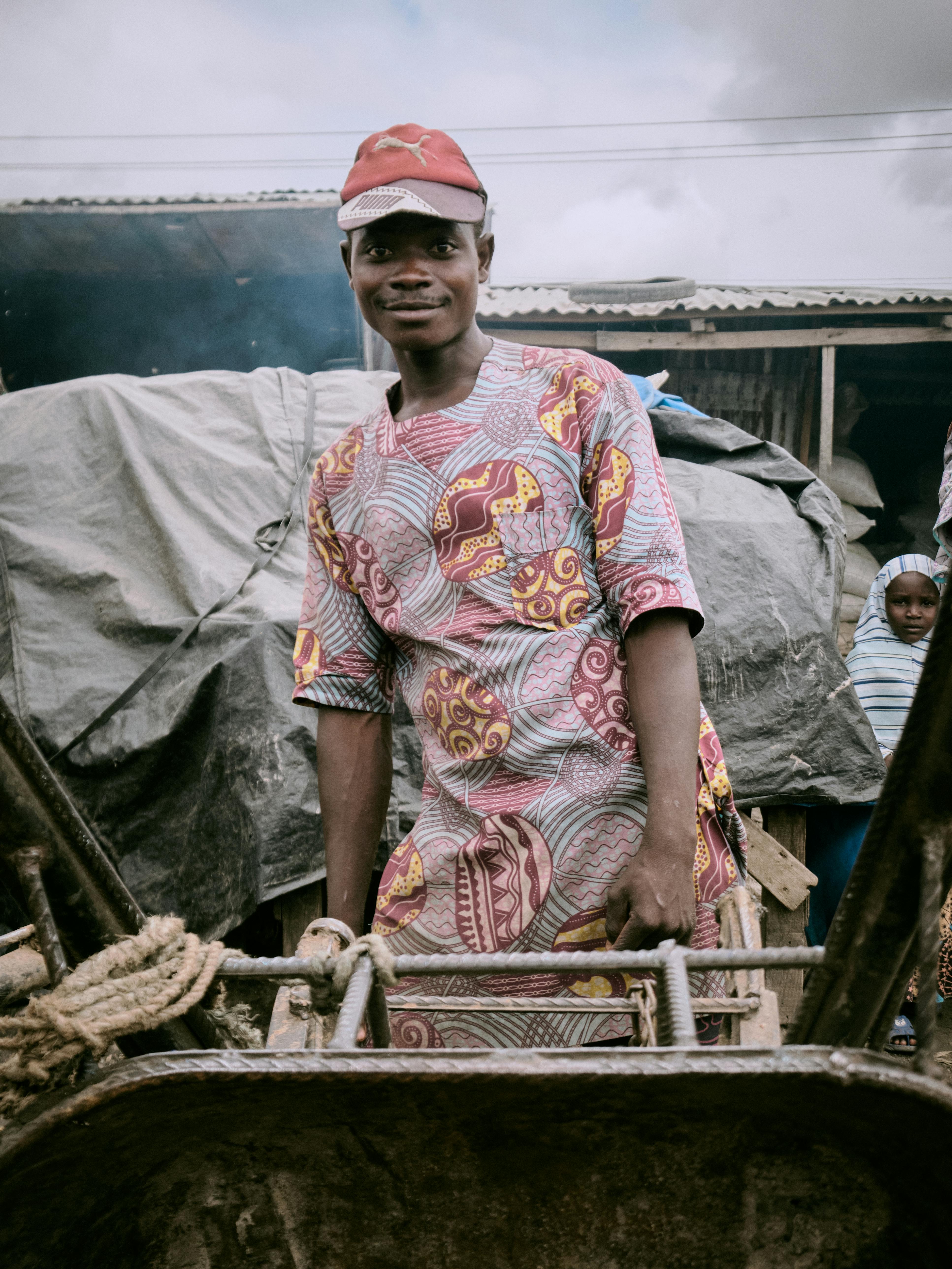 Man in Traditional Clothes Working Outdoors · Free Stock Photo