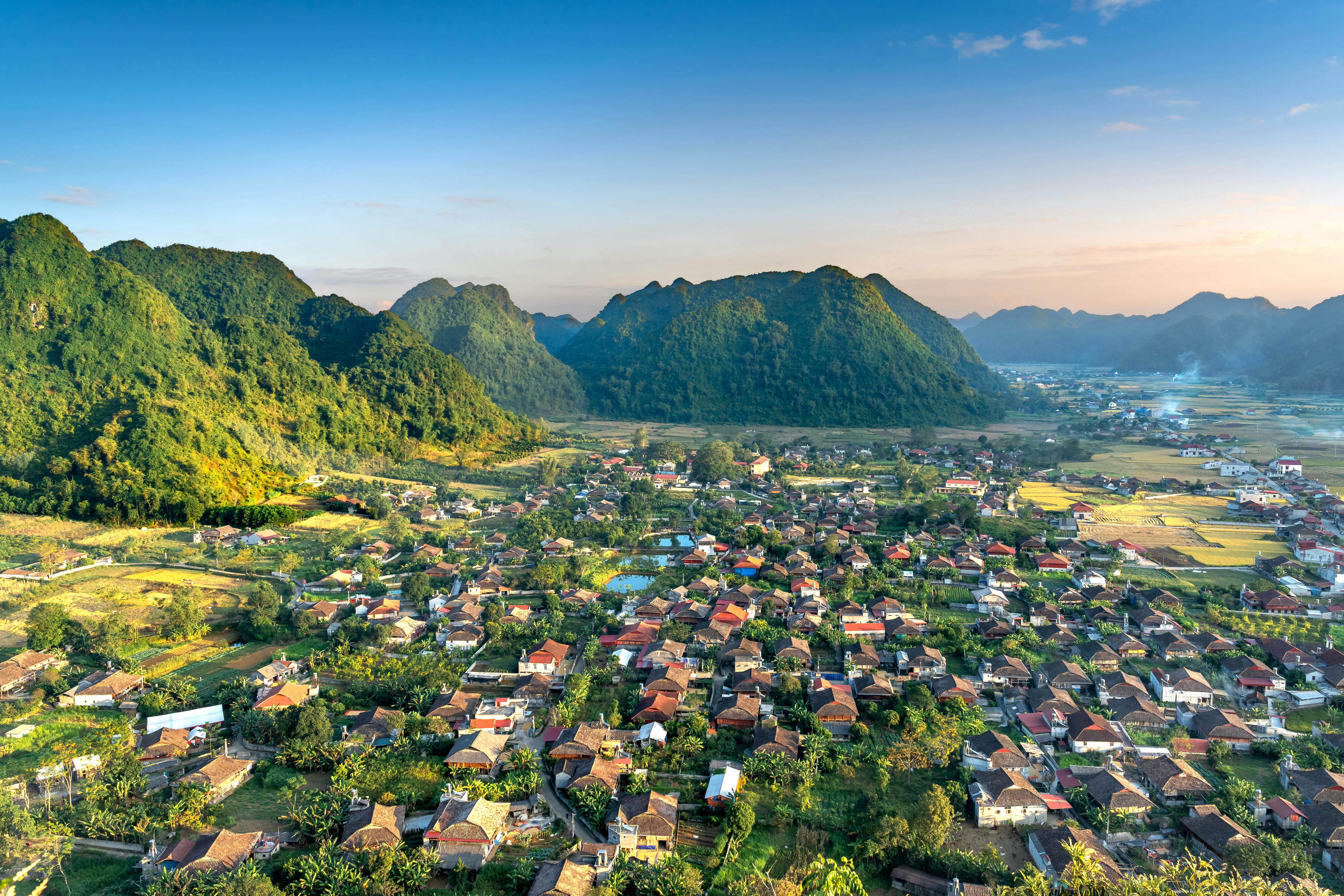 Aerial Photo of a Village and Mountains · Free Stock Photo
