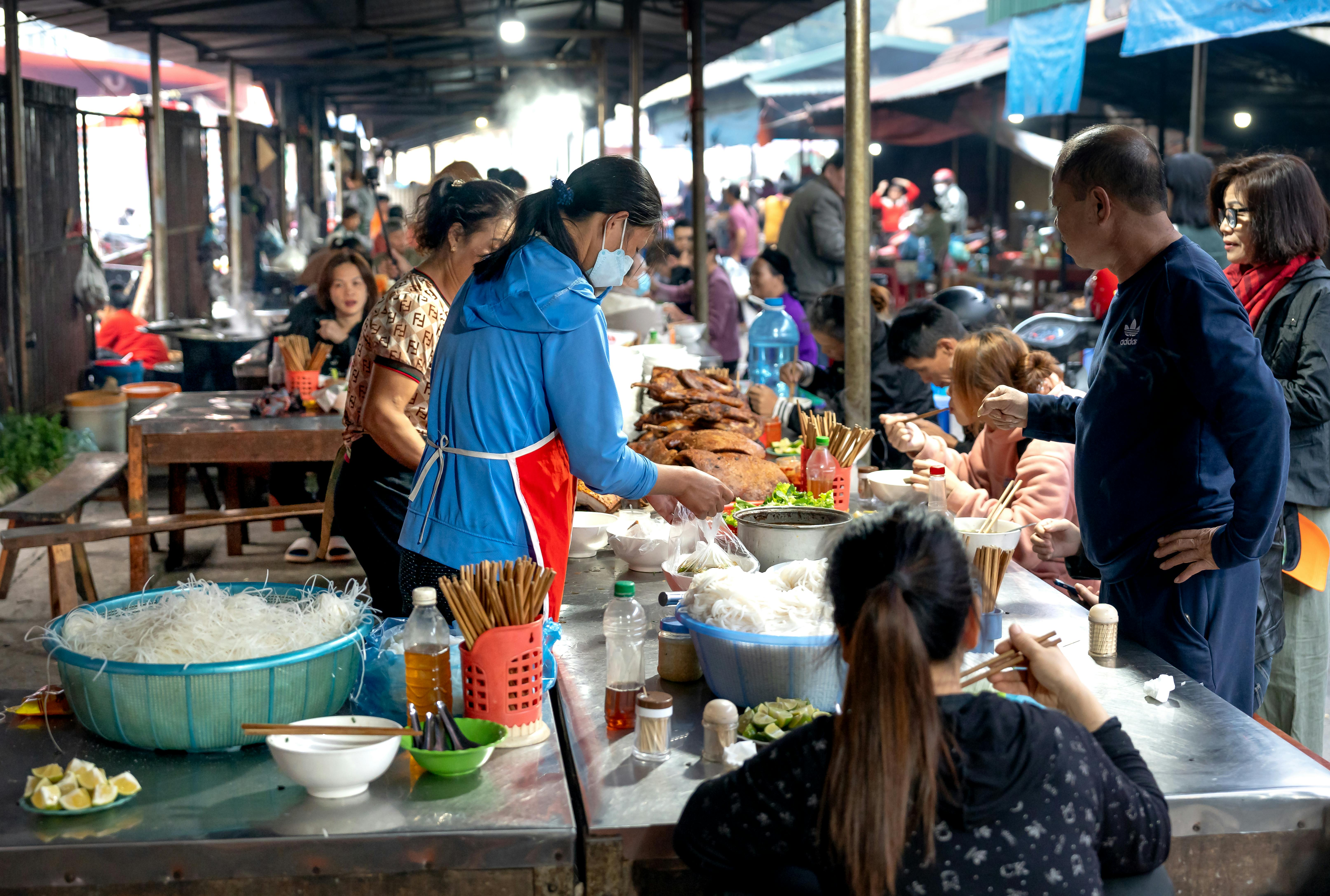 Merchants Selling Food on Market · Free Stock Photo